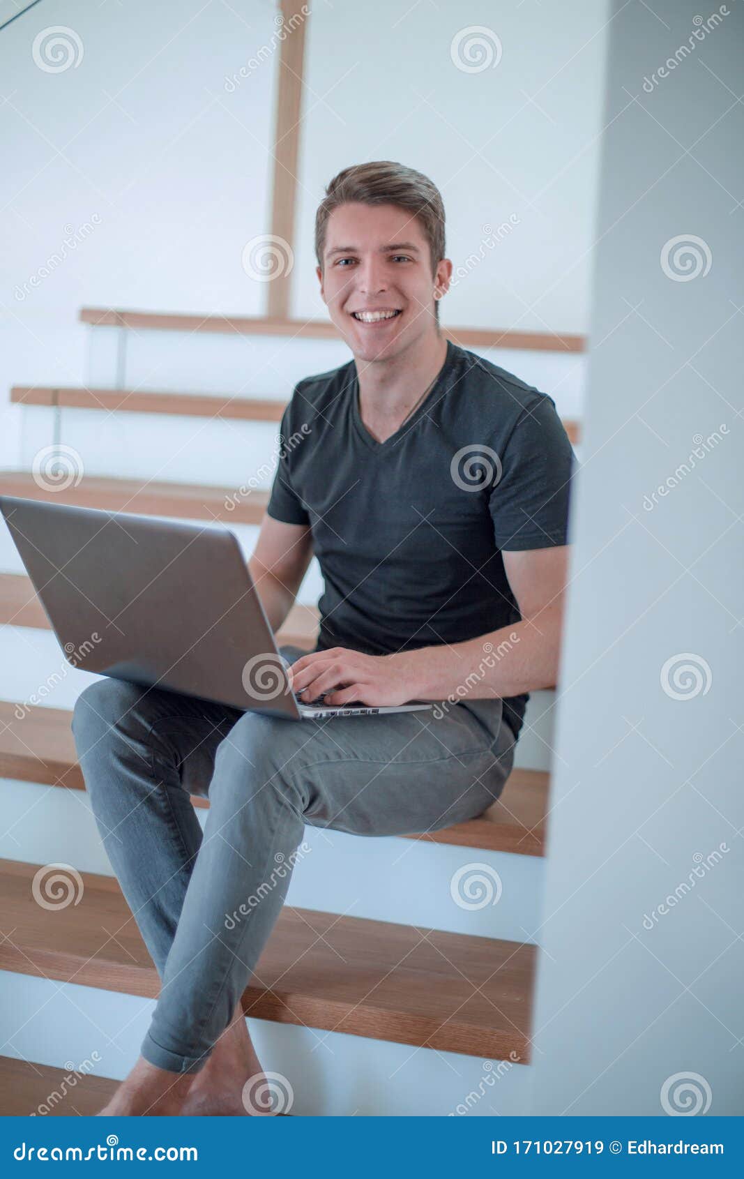 Cheerful Young Man Talking by Video Link Using Laptop Stock Image ...