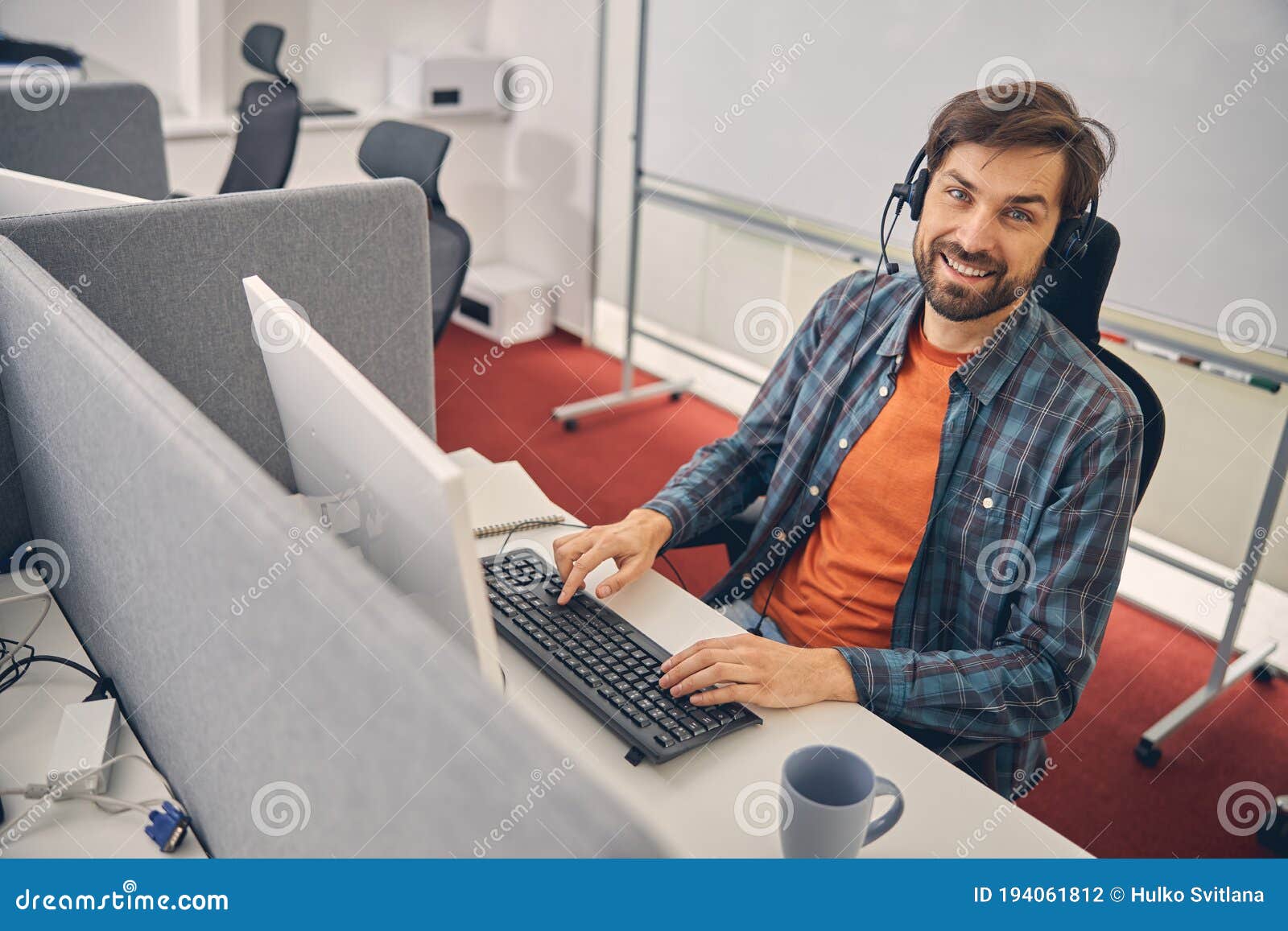 Cheerful Young Man Using Desktop PC at Work Stock Photo - Image of ...
