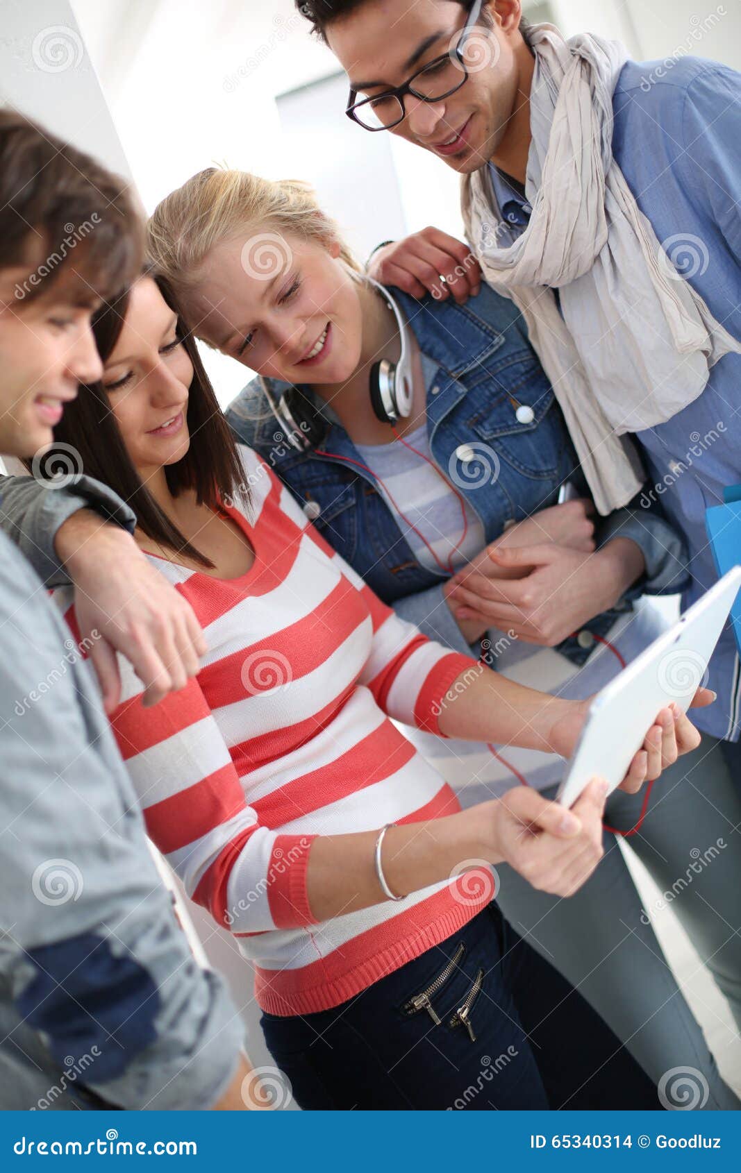 Cheerful Young People Using Tablet Stock Photo - Image of brunette ...