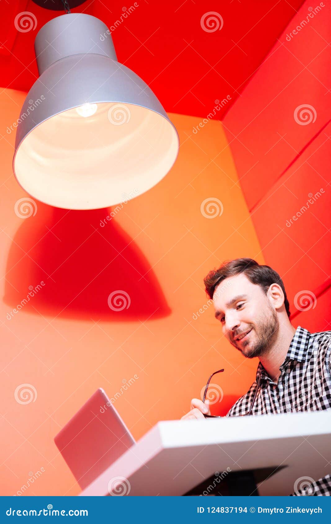 Cheerful Young Programmer Looking at the Screen and Feeling Glad Stock ...