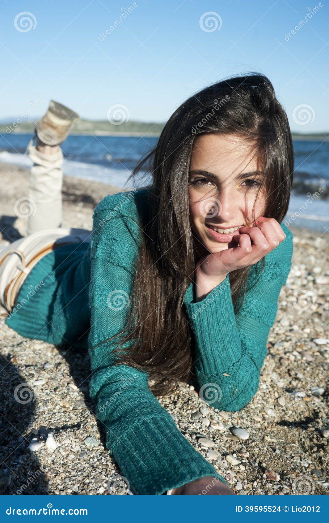Cheerful Young Woman Lying on the Beach Stock Photo - Image of ...