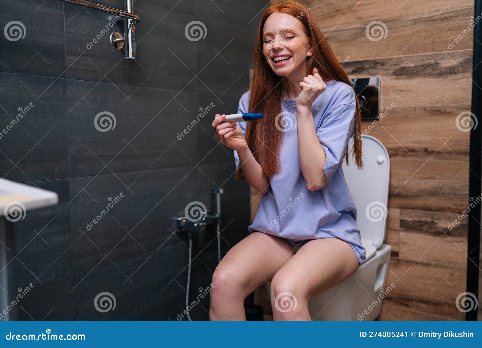 Cheerful Young Woman Rejoicing In Positive Pregnancy Kit Test For