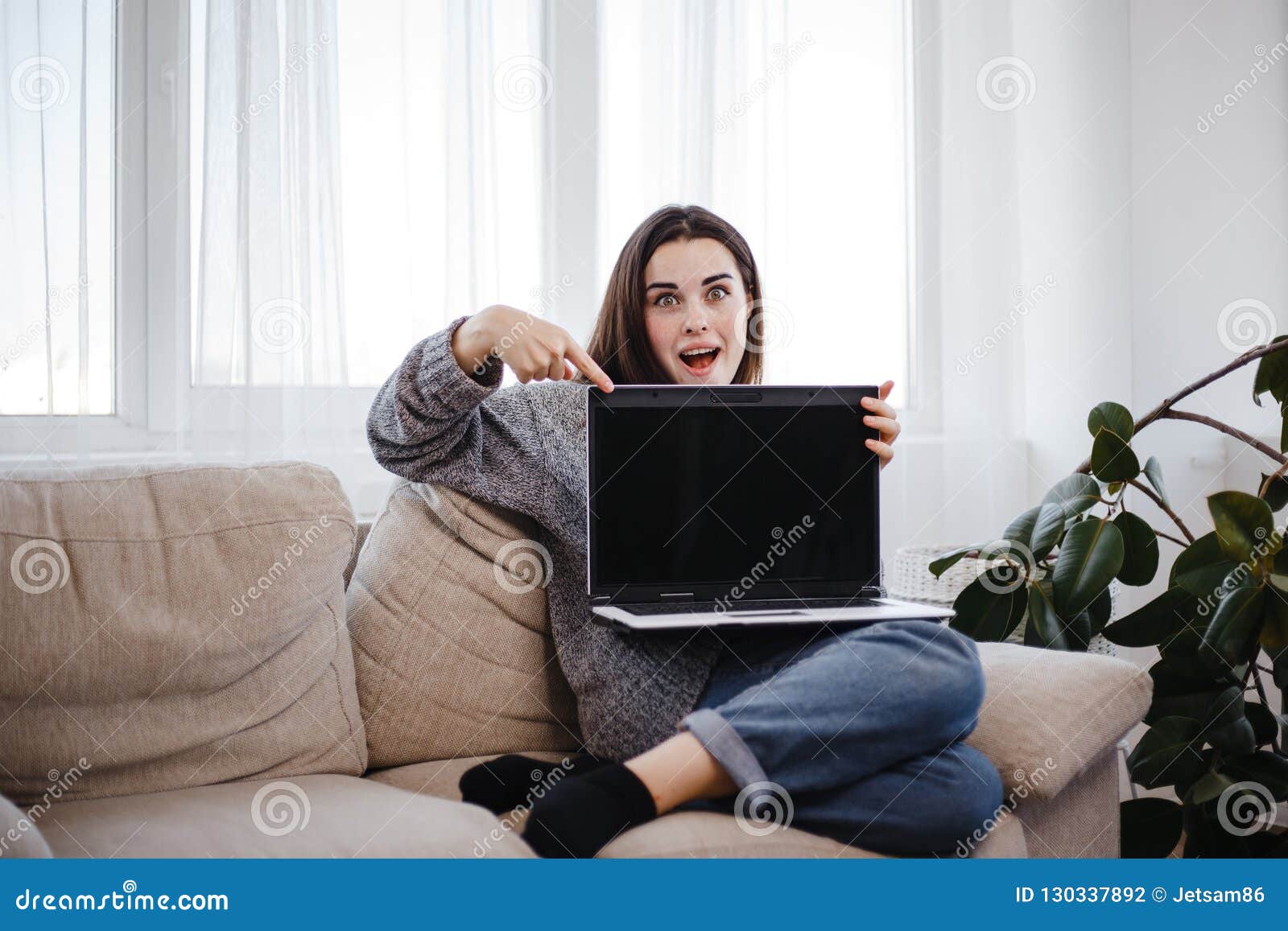 Cheerful Young Woman Showing a Blank Laptop Screen Stock Photo - Image ... Cheerful Young Woman Showing a Blank Laptop Screen Stock Photo - Image ...