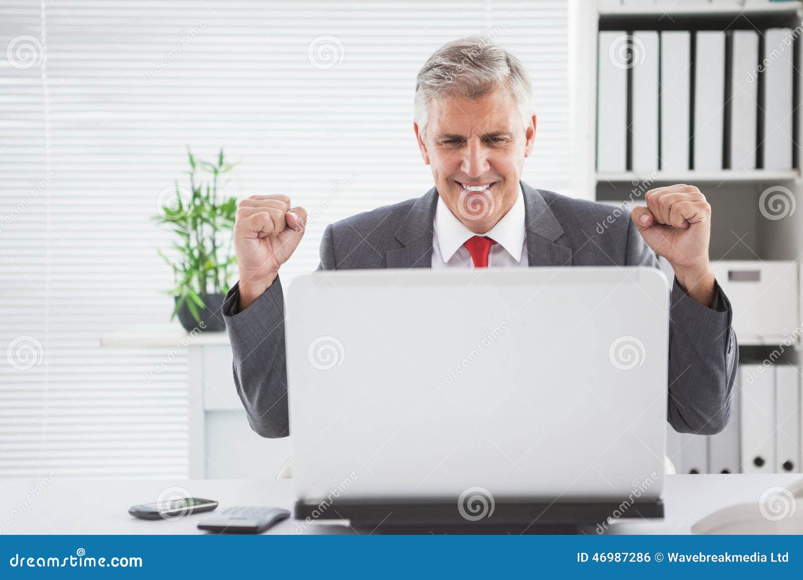 Cheering Businessman at His Desk Stock Photo - Image of male ...
