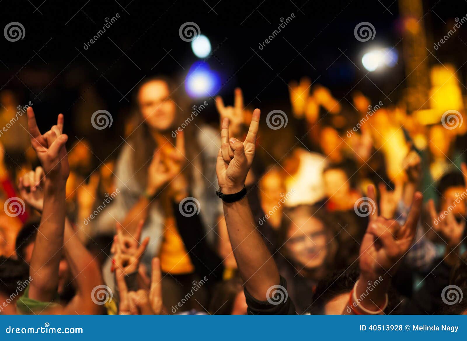 Cheering Crowd in Front of Stage Lights Stock Photo - Image of glowing ...