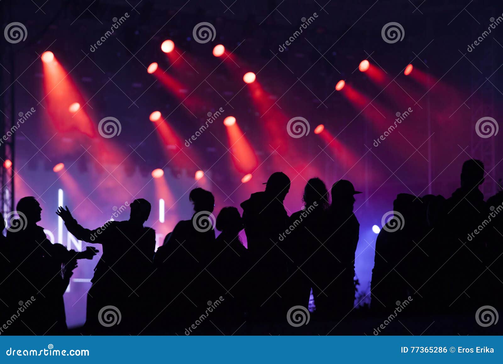 Cheering Crowd in Front of Stage Lights Stock Photo - Image of ...