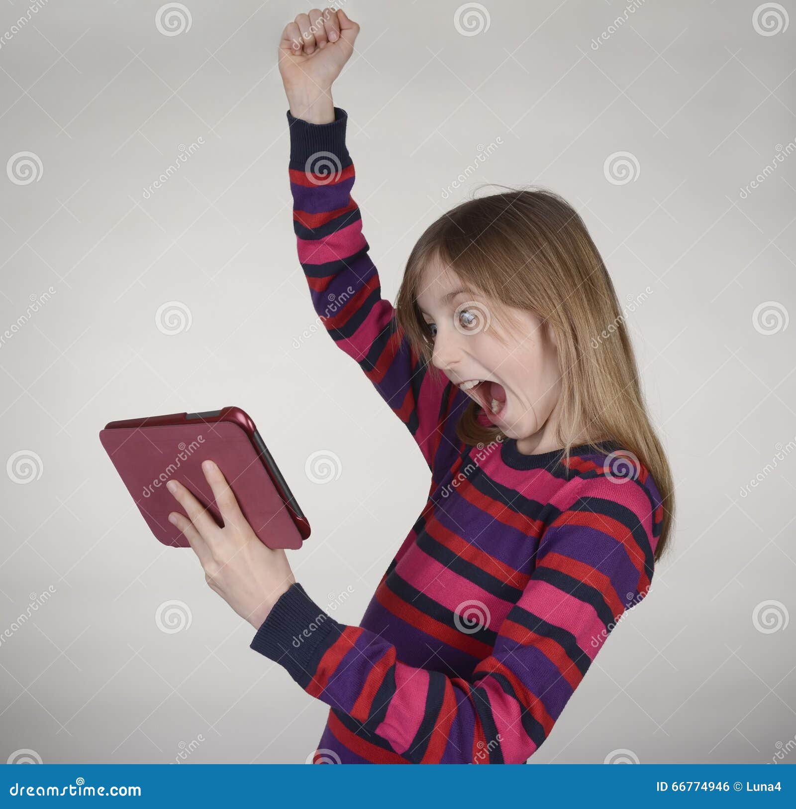 Cheering Girl with Digital Tablet Stock Photo - Image of laughing, game ...