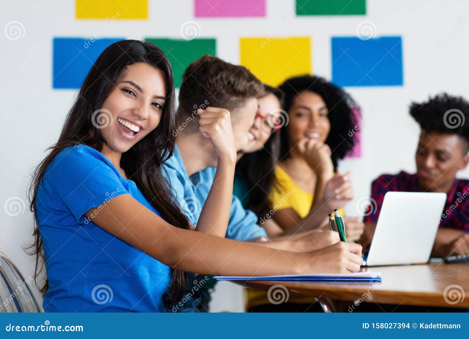 Cheering Hispanic Female Student Learning with Group of Students Stock ...