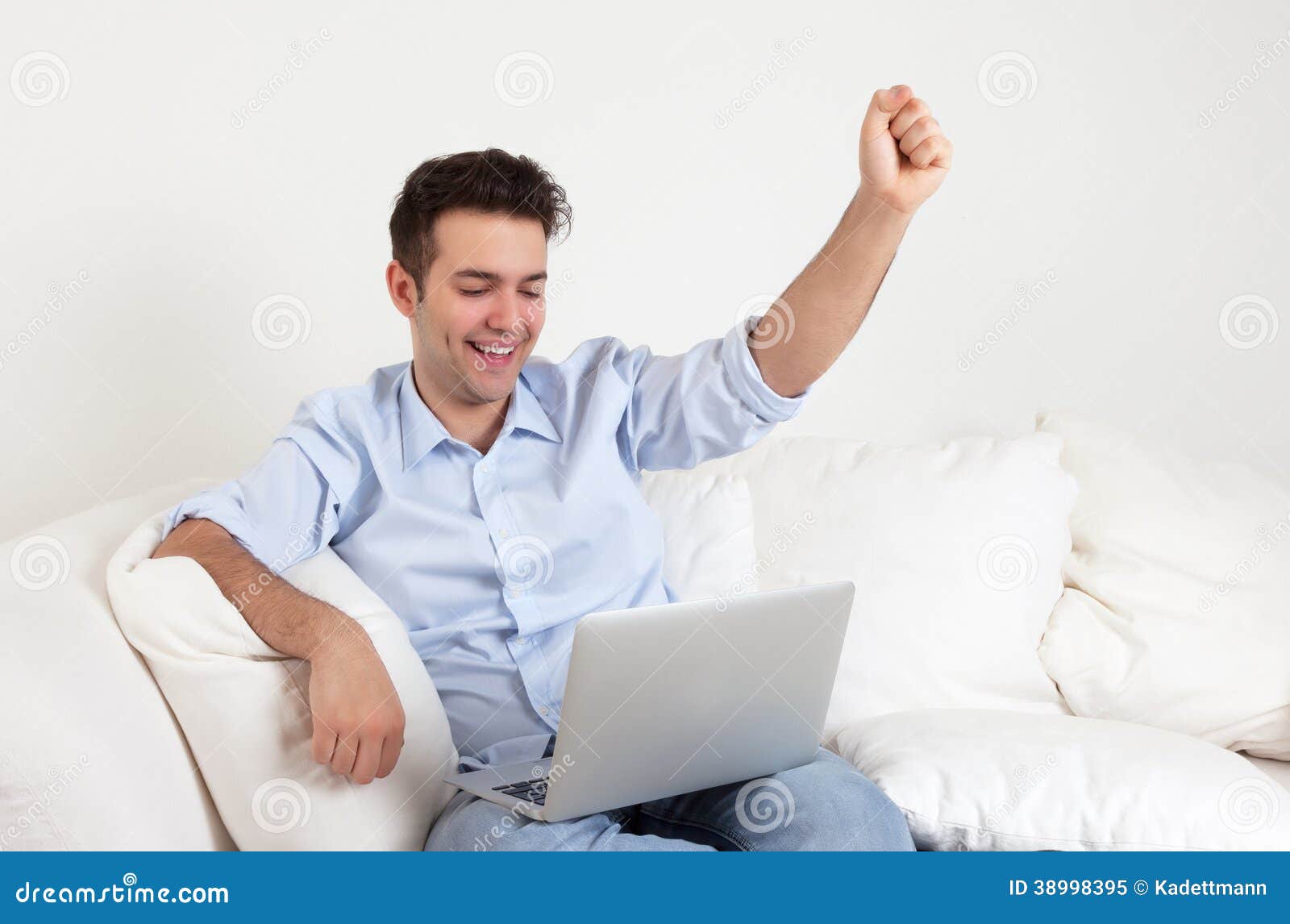 Cheering Hispanic Guy with Notebook on a Sofa Stock Image - Image of ...