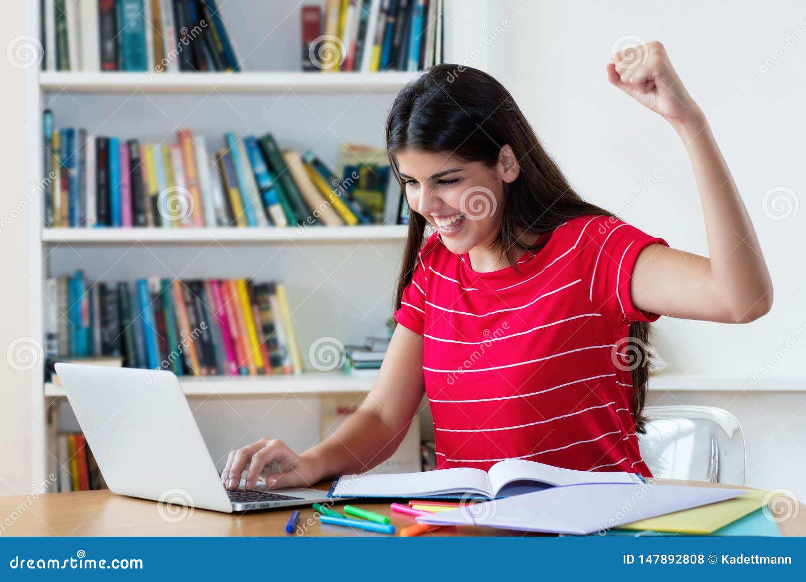 Cheering Mexican Female Student Learning on Computer Stock Photo ...