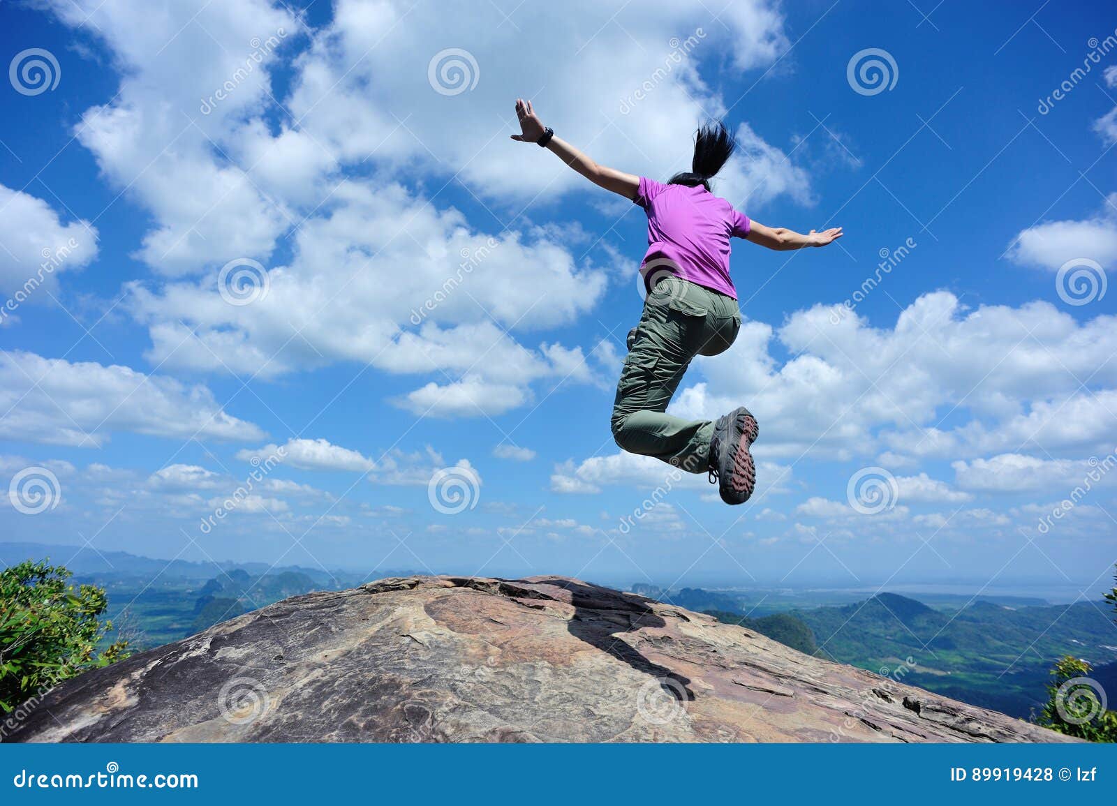 Young Woman Jumping on Mountain Peak Stock Photo - Image of excited ...