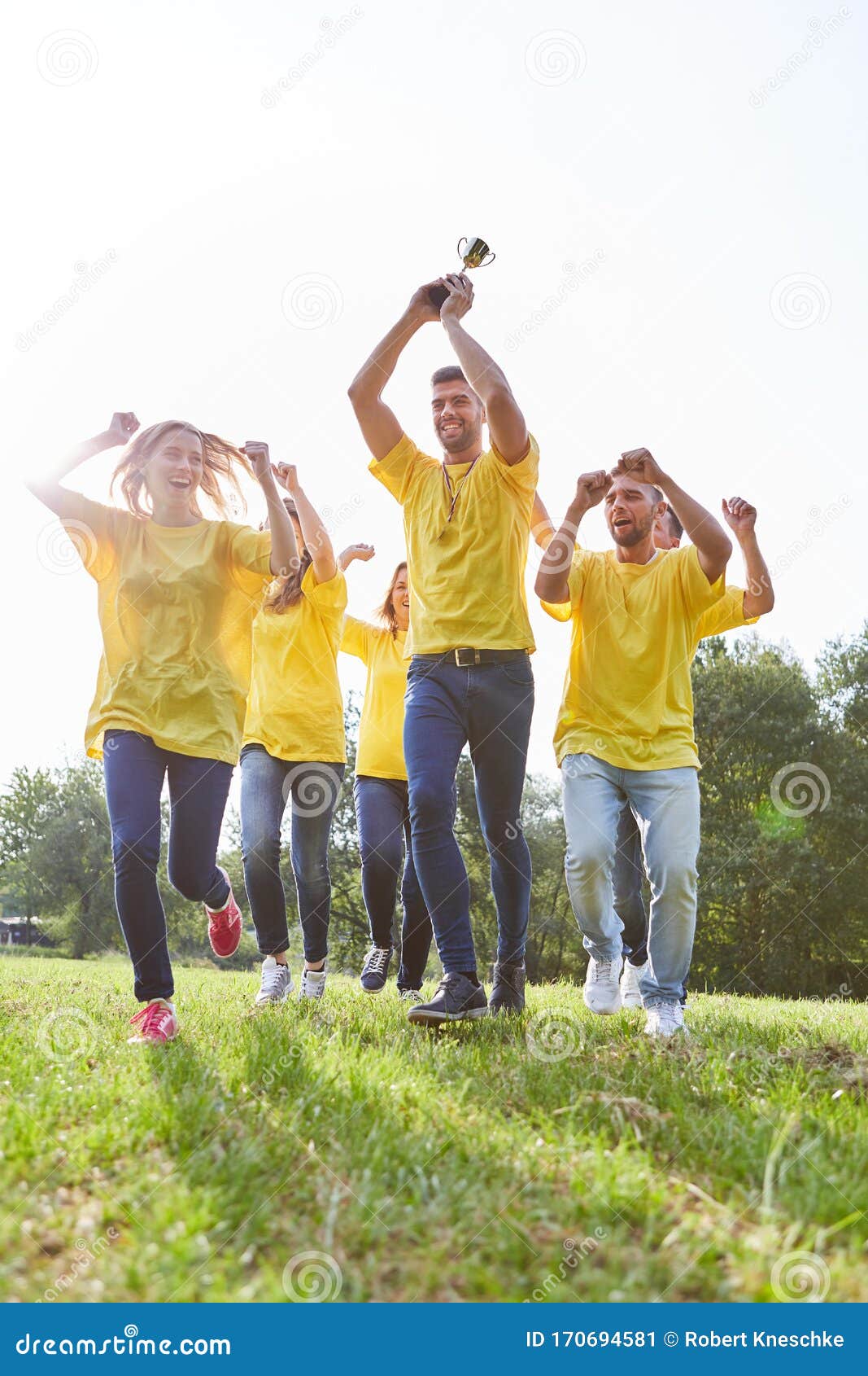 Cheering Winner Team with a Trophy Stock Image - Image of nature ...