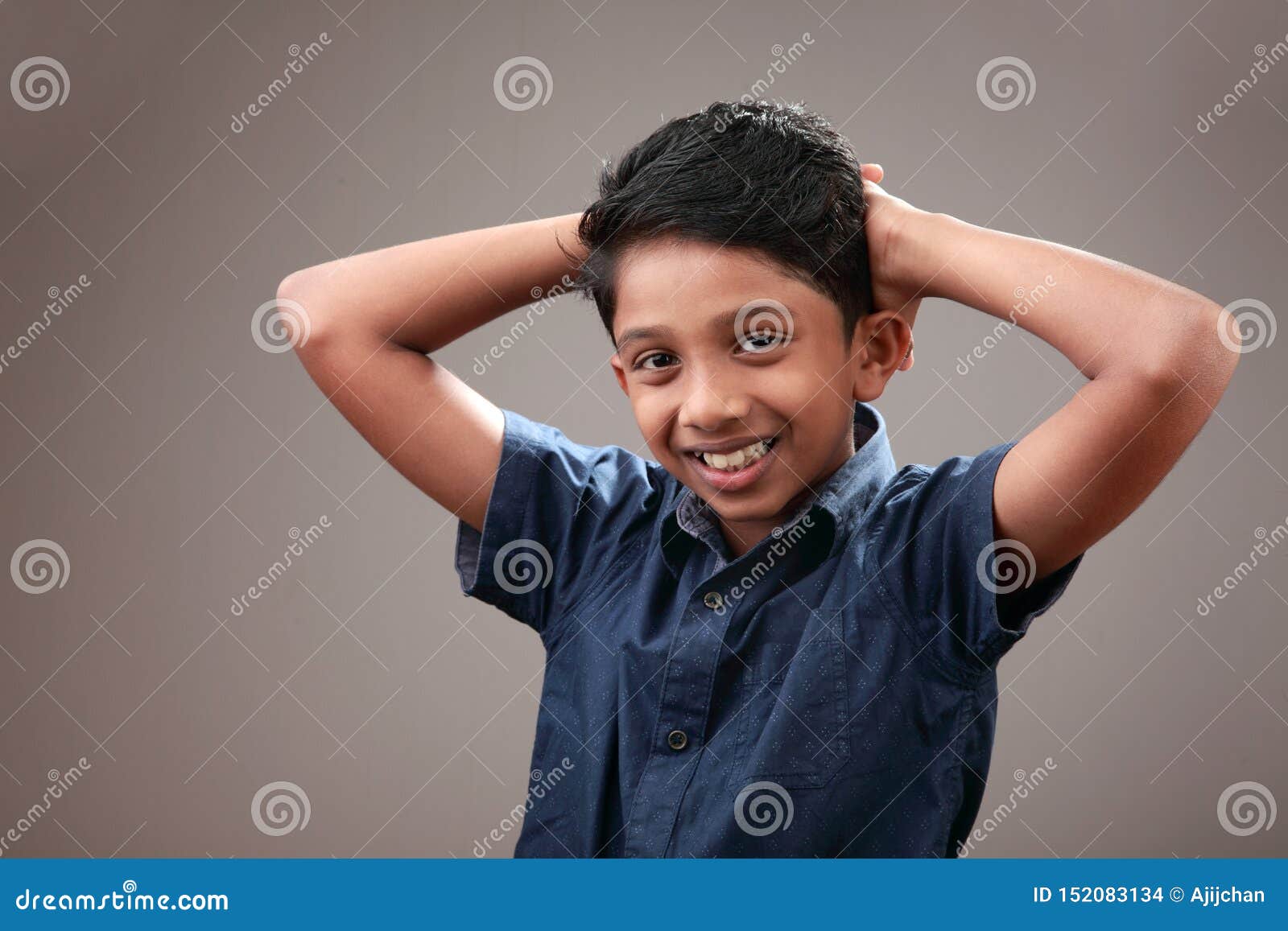 A cheering young boy stock photo. Image of joyful, looking - 152083134