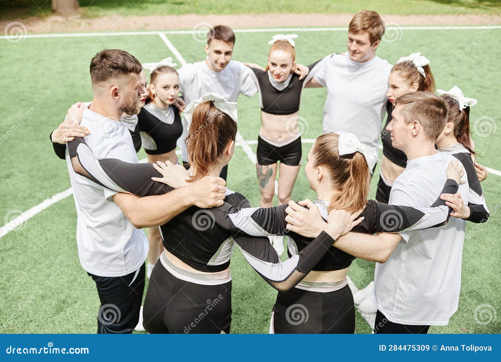 Cheerleader Team Standing in Circle with Coach Stock Image - Image of ...
