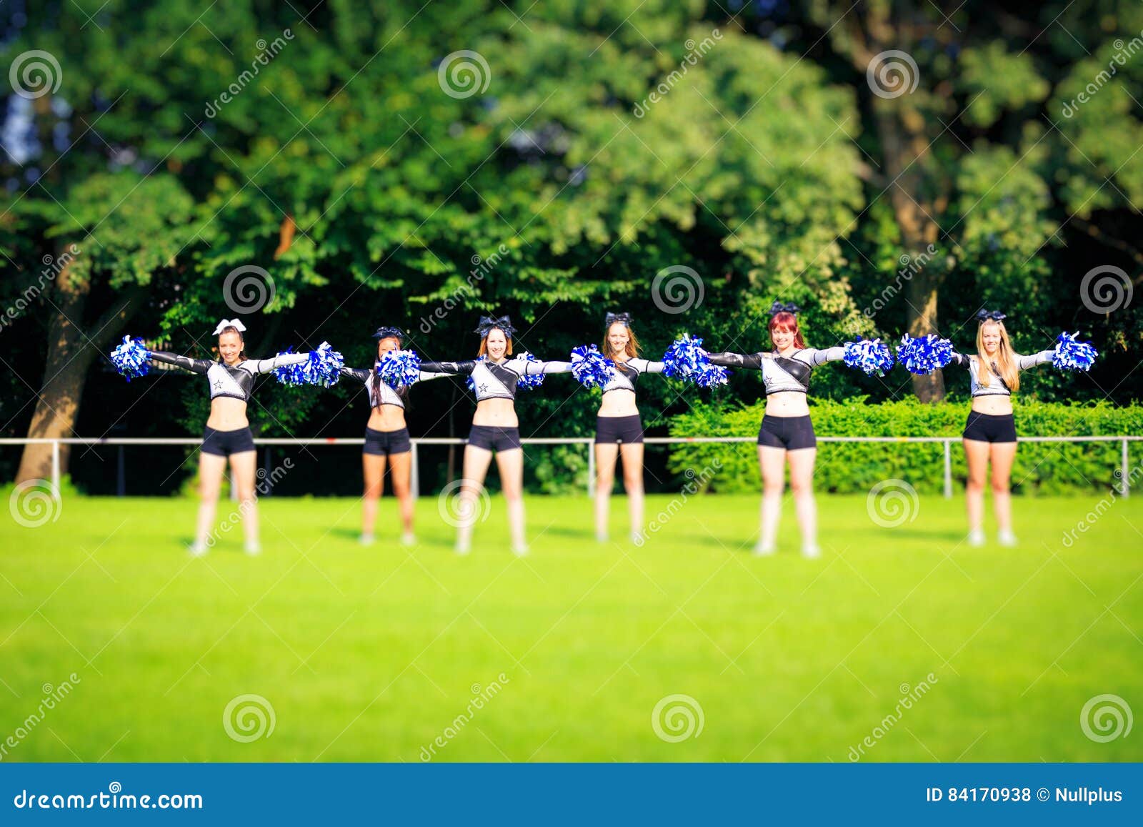 Cheerleaders Practicing Outdoors Stock Photo - Image of cheerleader ...