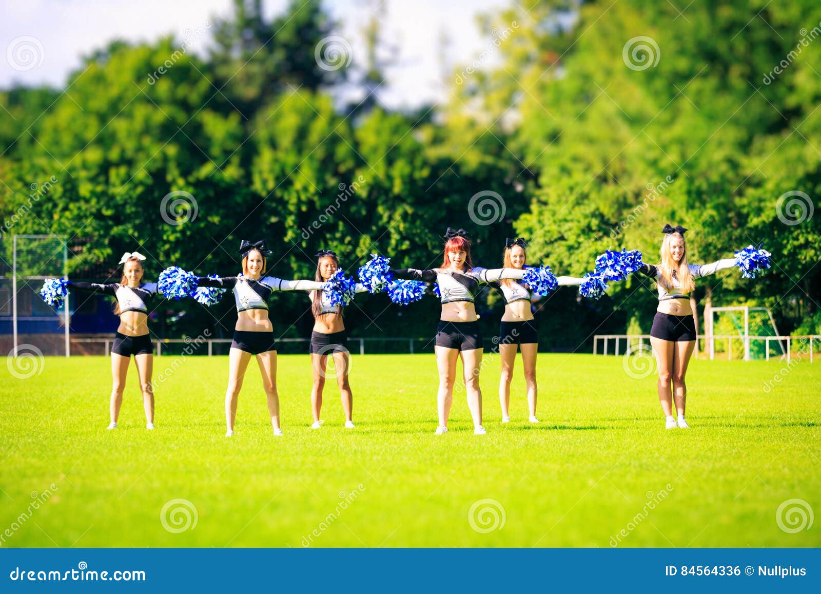 Cheerleaders Team Practicing Stock Photo - Image of field, team: 84564336