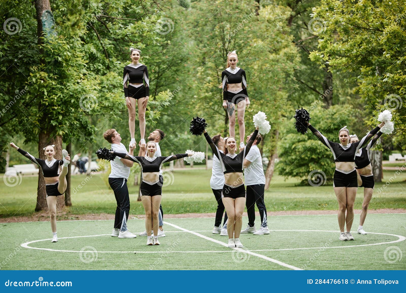 Cheerleading Team Dancing at Competition Outdoors Stock Photo - Image ...