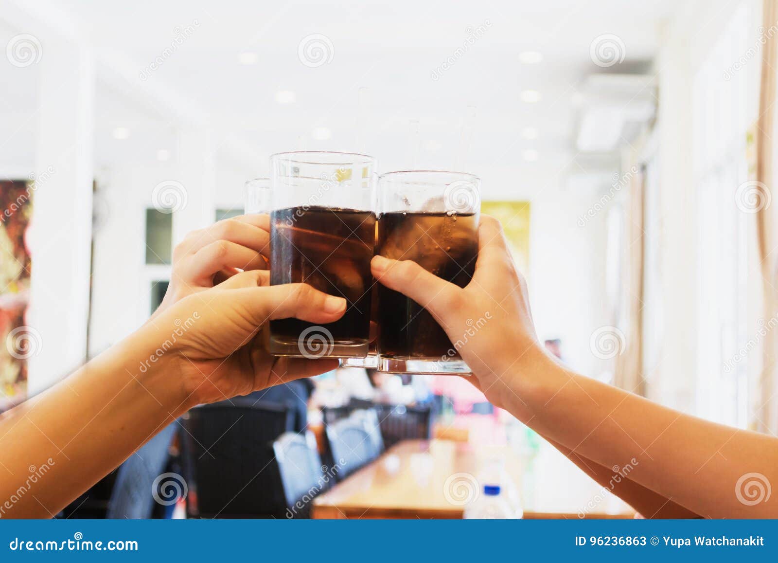 Cheers! Group of People Cheering with Beverage in Restaurant Stock ...