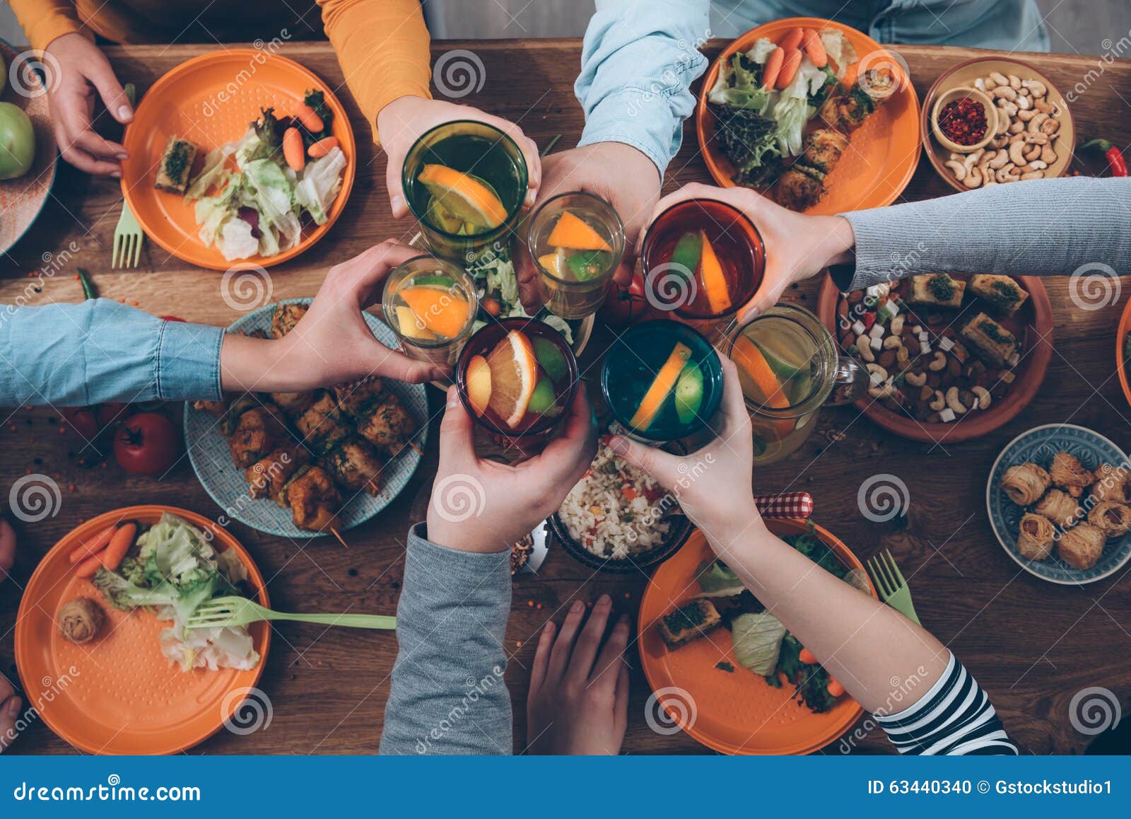 Cheers! stock photo. Image of desk, rustic, dinner, people - 63440340