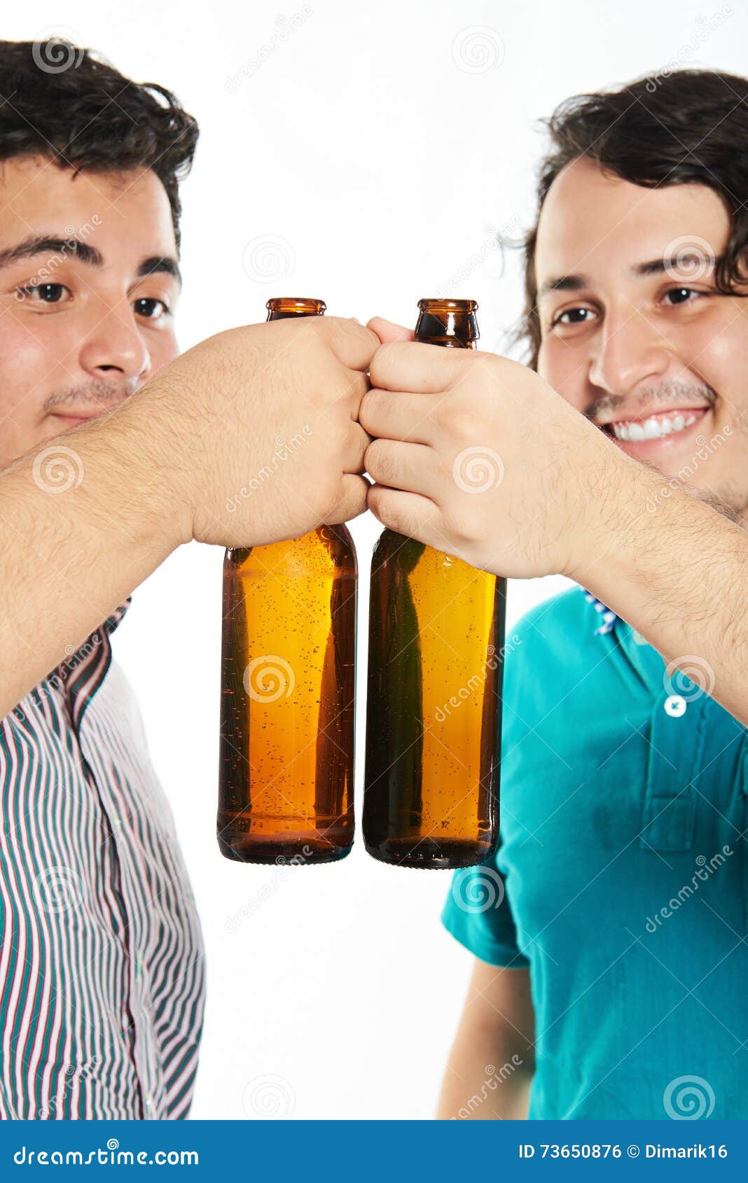 Cheersing two young man stock photo. Image of holding - 73650876
