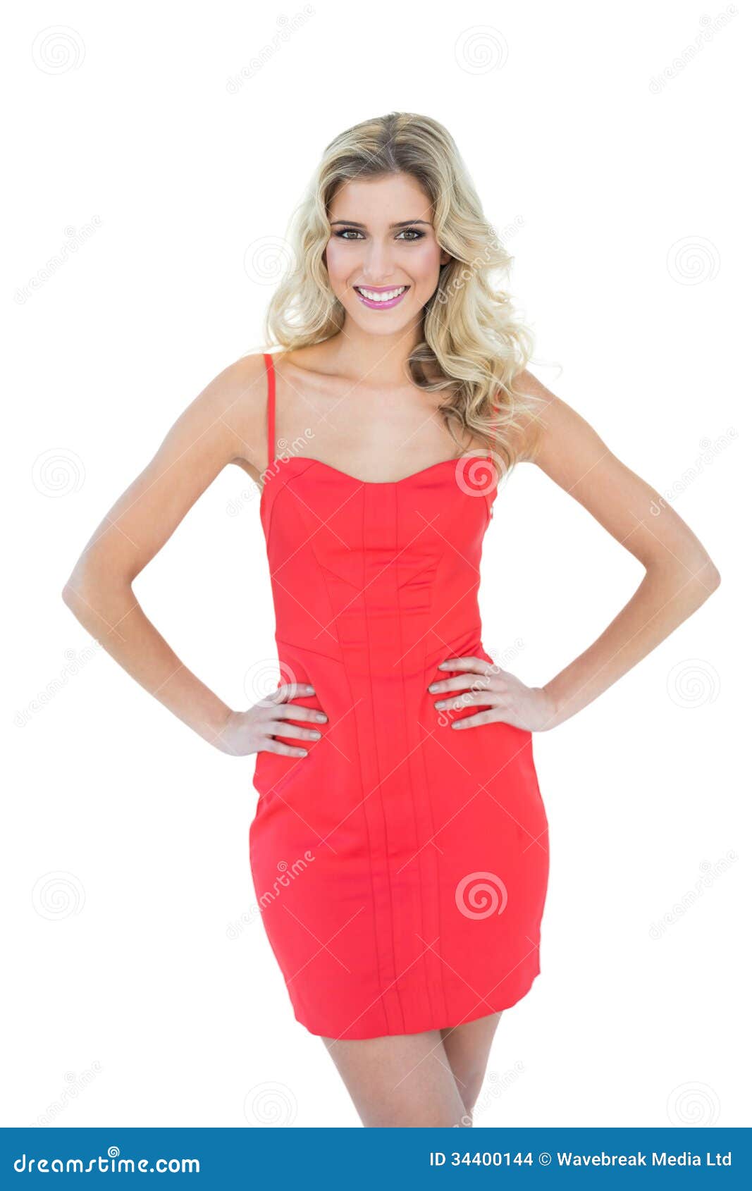 Cheery Smiling Blonde Model Posing with Hands on Hips Stock Photo ...