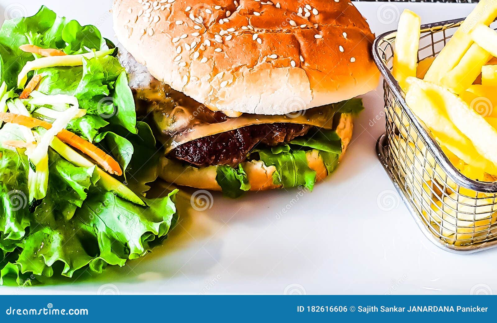 Cheese and Beef Burger with Green Leaf and Yellow Fried Potato Chips ...