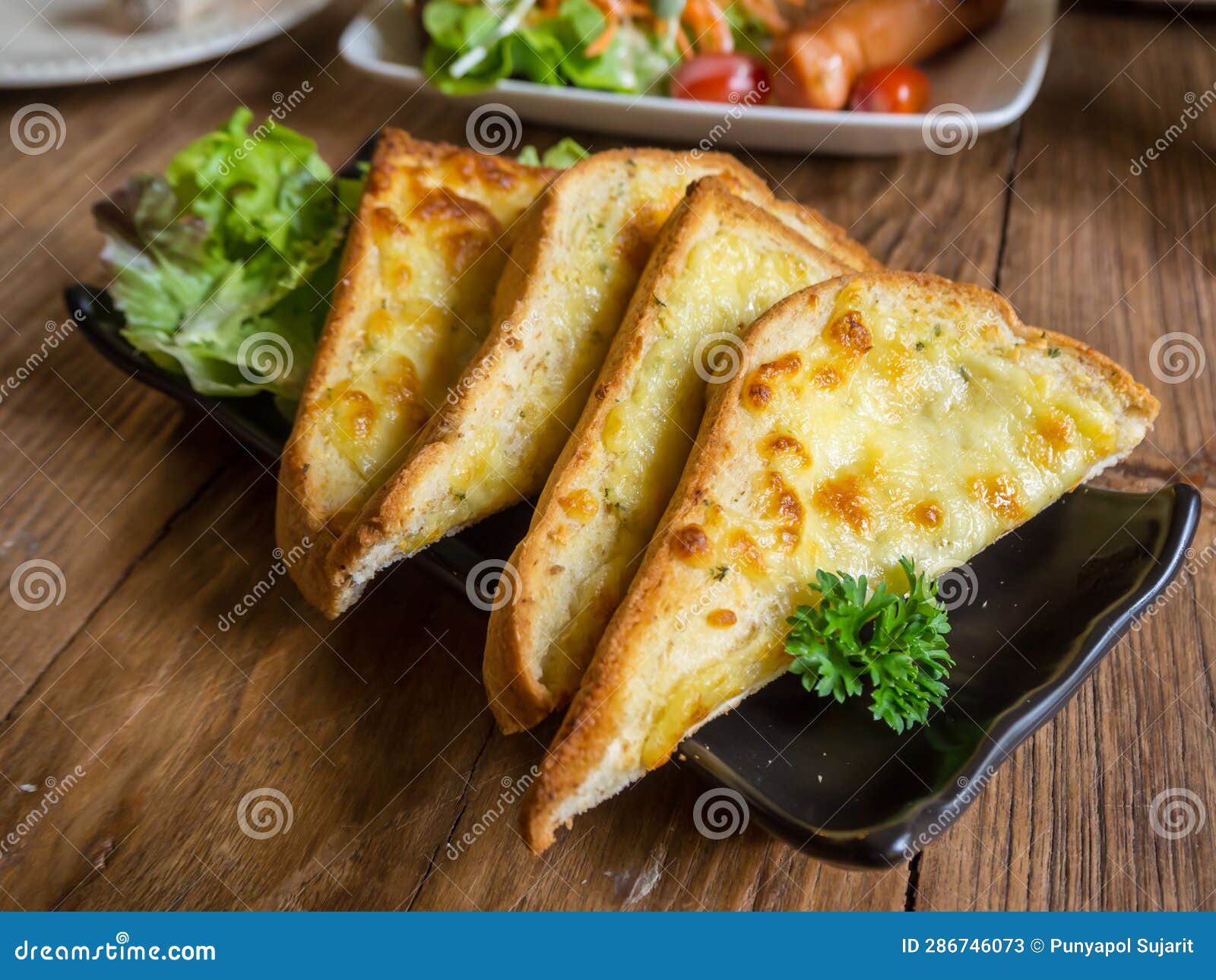 Cheese Bread in a Rectangle Black Dish Stock Image - Image of pepper ...