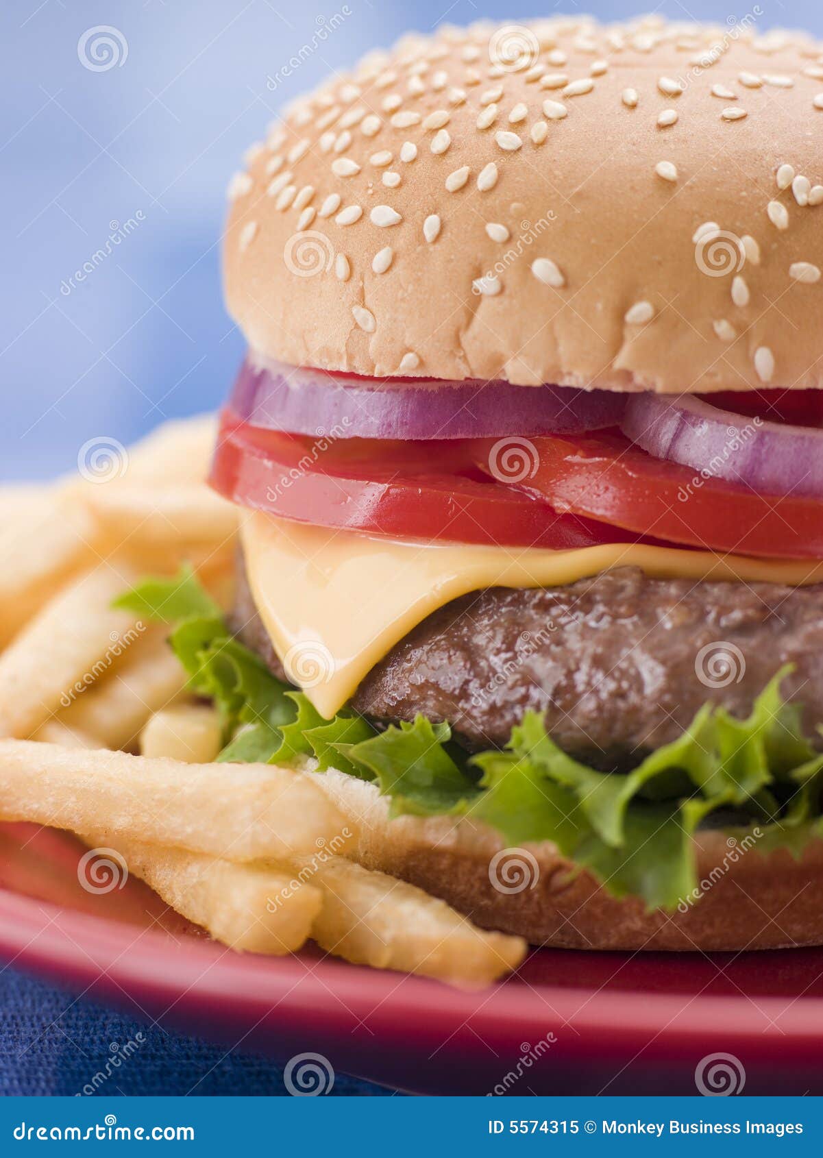 Cheese Burger in a Sesame Seed Bun with Fries Stock Image - Image of ...