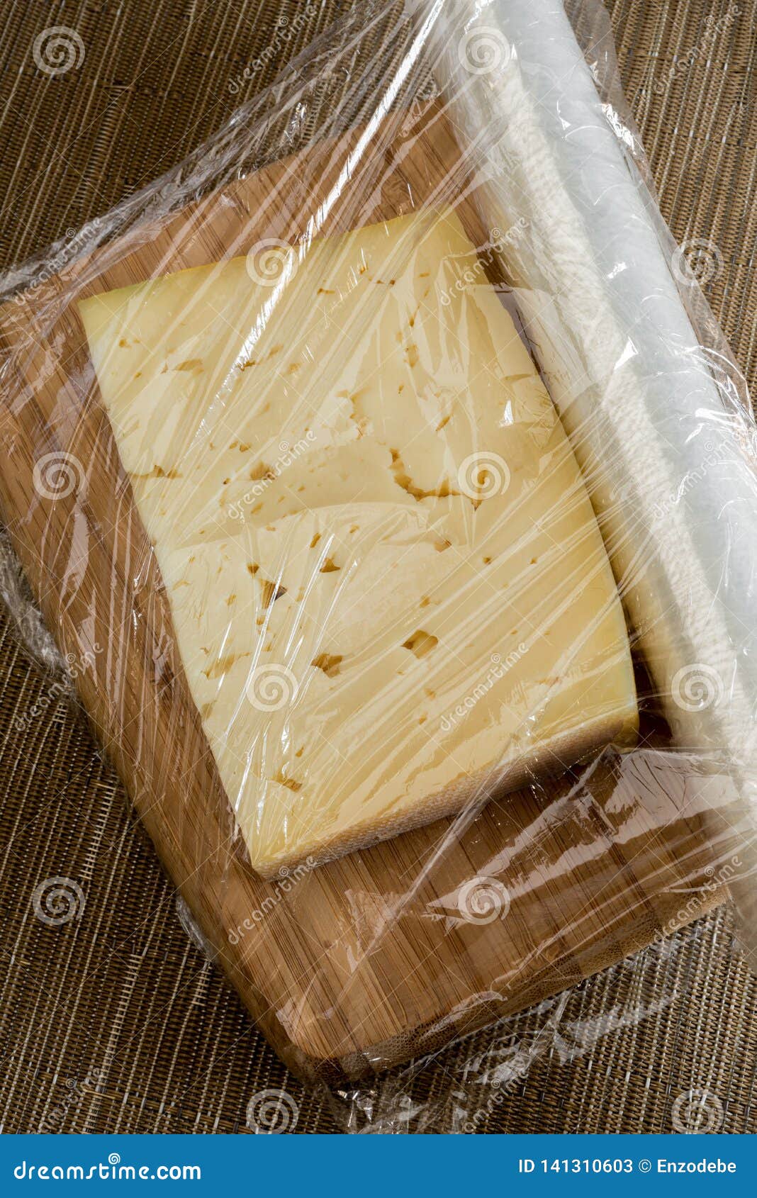 Cheese coated with plastic stock image. Image of industry - 141310603