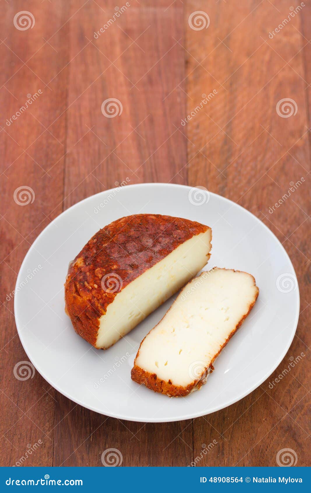 Cheese on dish on brown stock photo. Image of white, wooden - 48908564