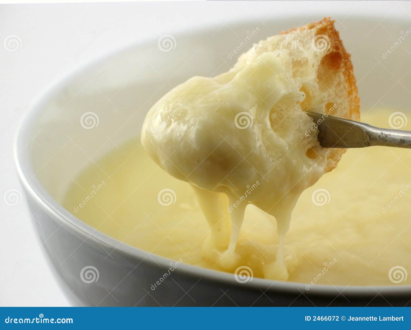 Cheese fondue half dipped stock photo. Image of cheese - 2466072