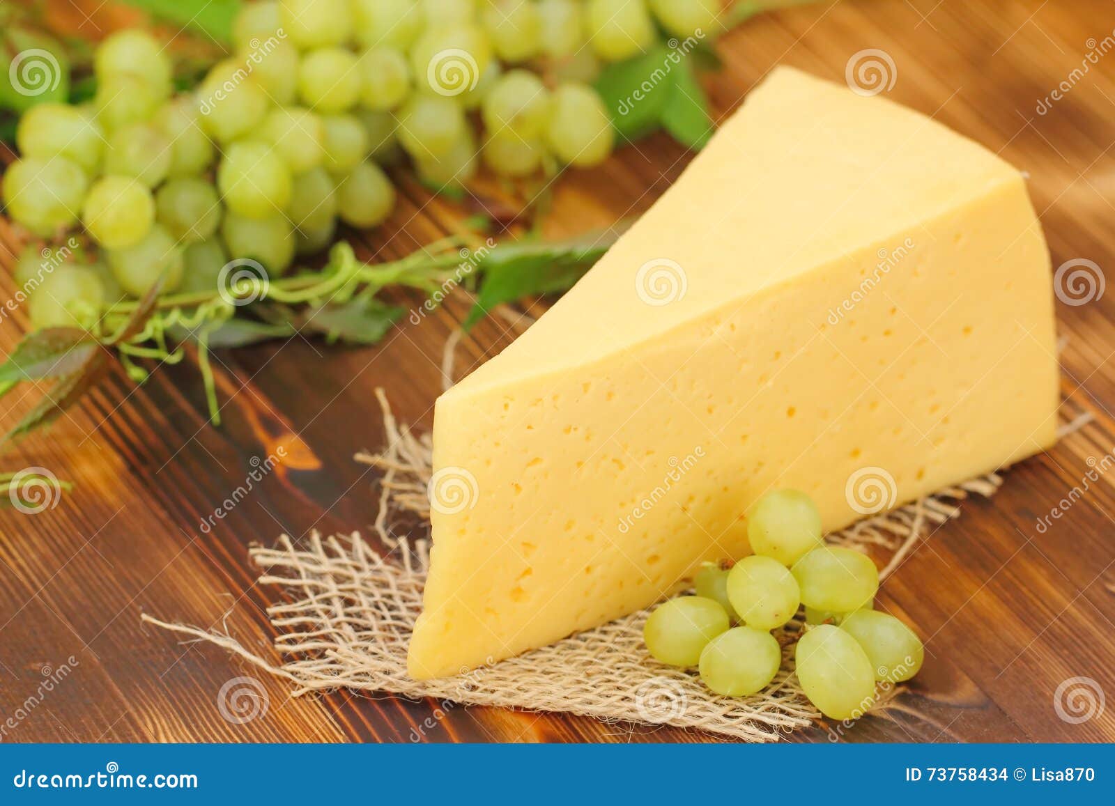 Cheese and grape stock photo. Image of cheddar, leaf - 73758434
