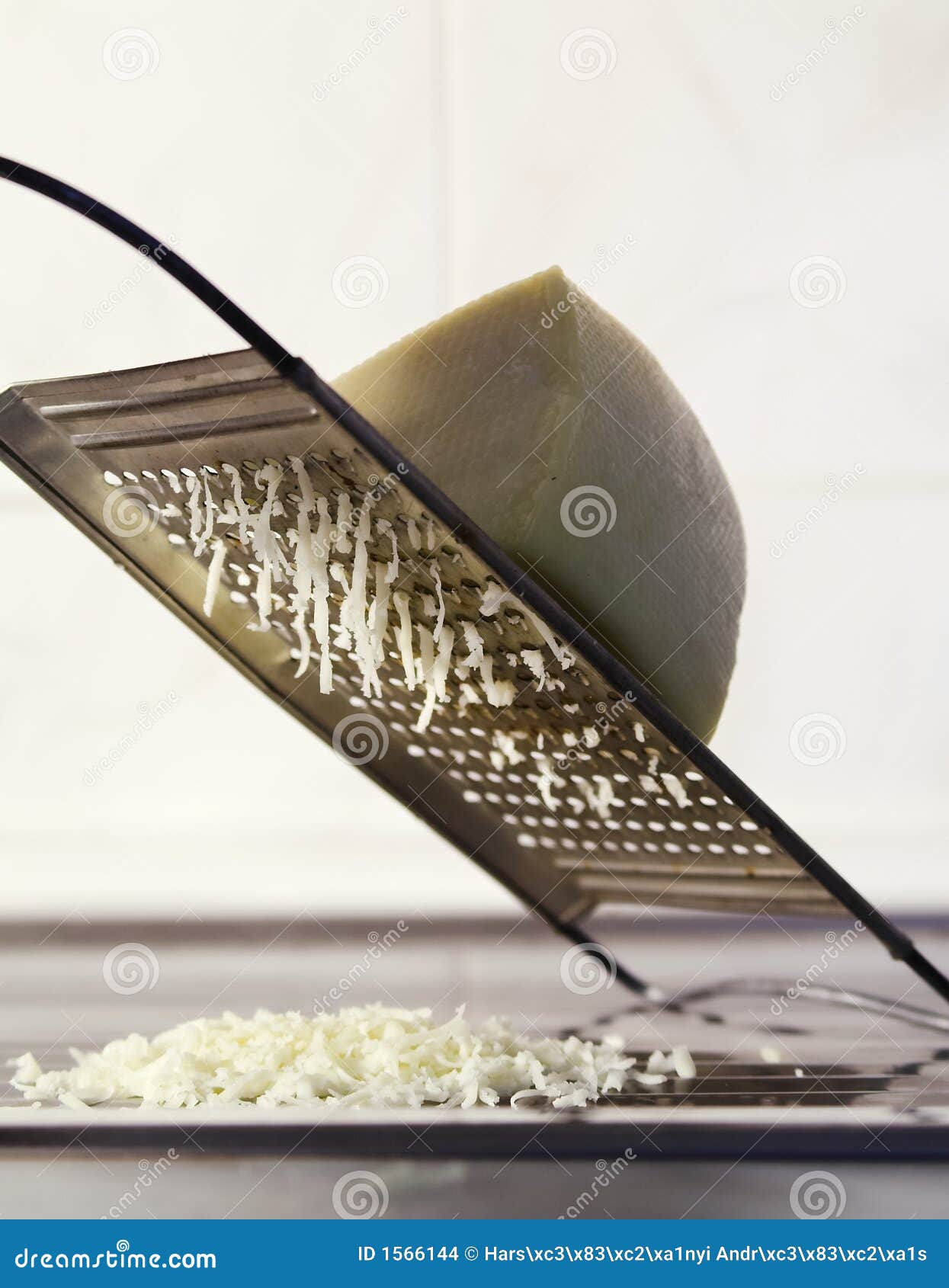 Cheese Grater And Blocks Of Cheddar Cheese On Solid Background Royalty ...