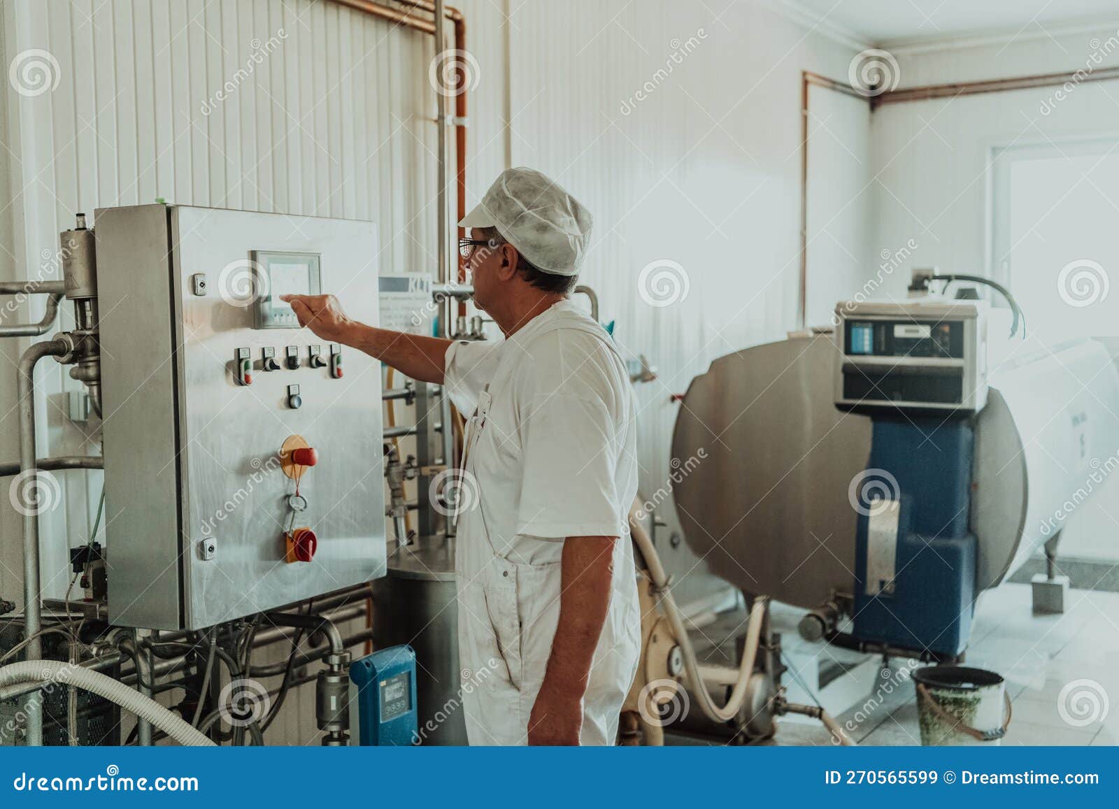 Cheese Maker Working in the Modern Industry on Machines that are Using ...