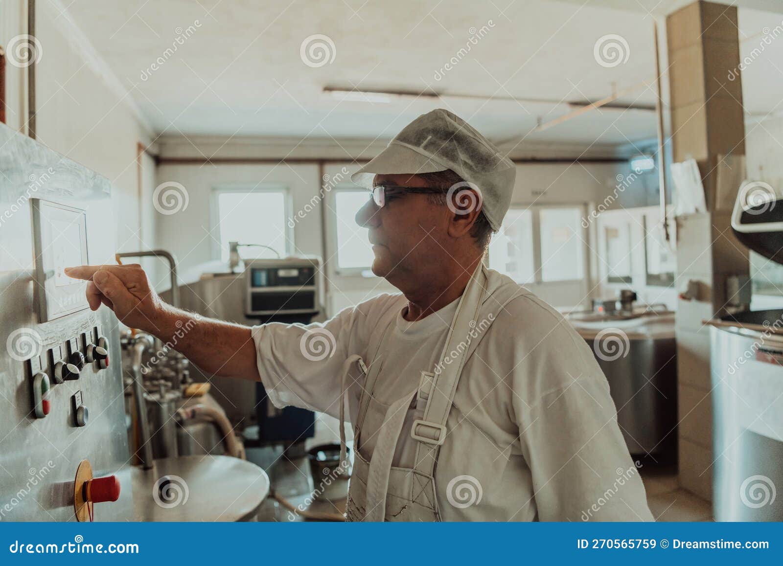Cheese Maker Working in the Modern Industry on Machines that are Using ...