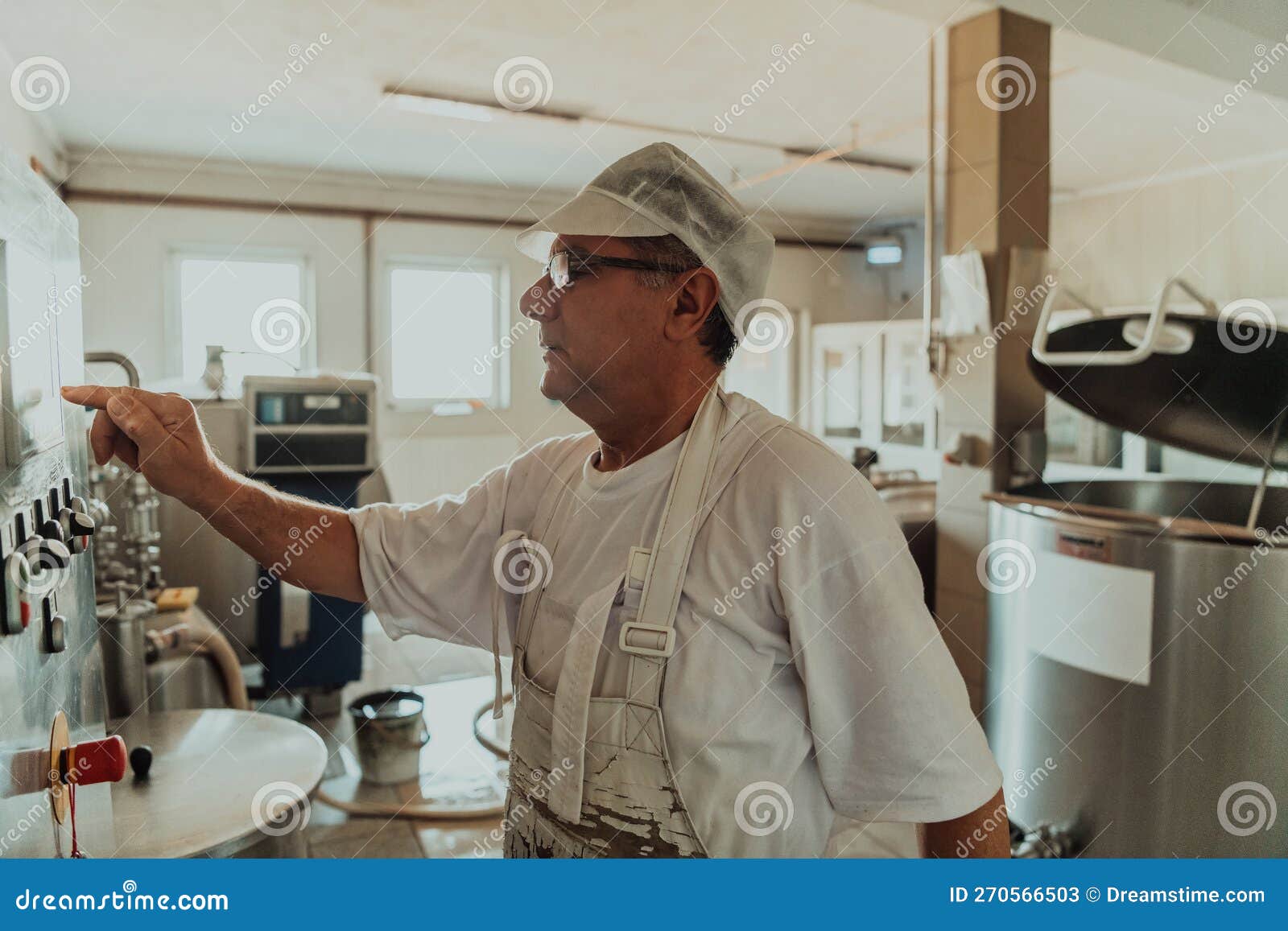 Cheese Maker Working in the Modern Industry on Machines that are Using ...