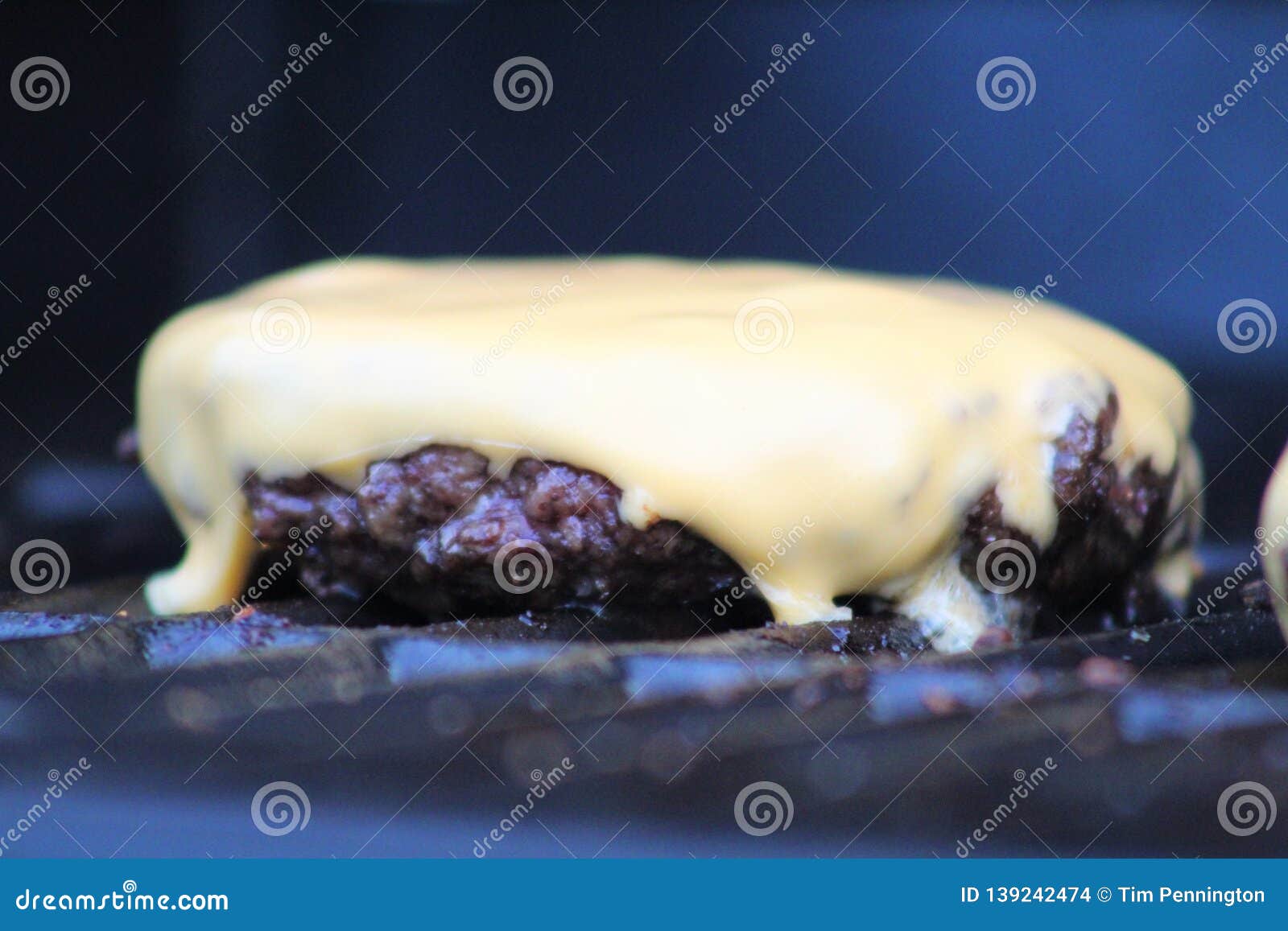 Cheeseburger Grilling on the Barbecue Stock Photo - Image of melting ...