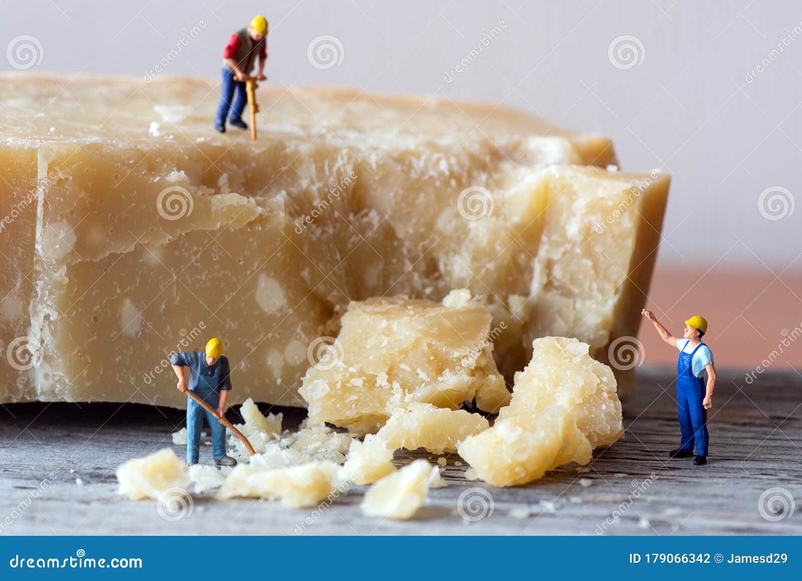 Cheese Mining Process by Miniature Men Stock Photo - Image of bucket ...