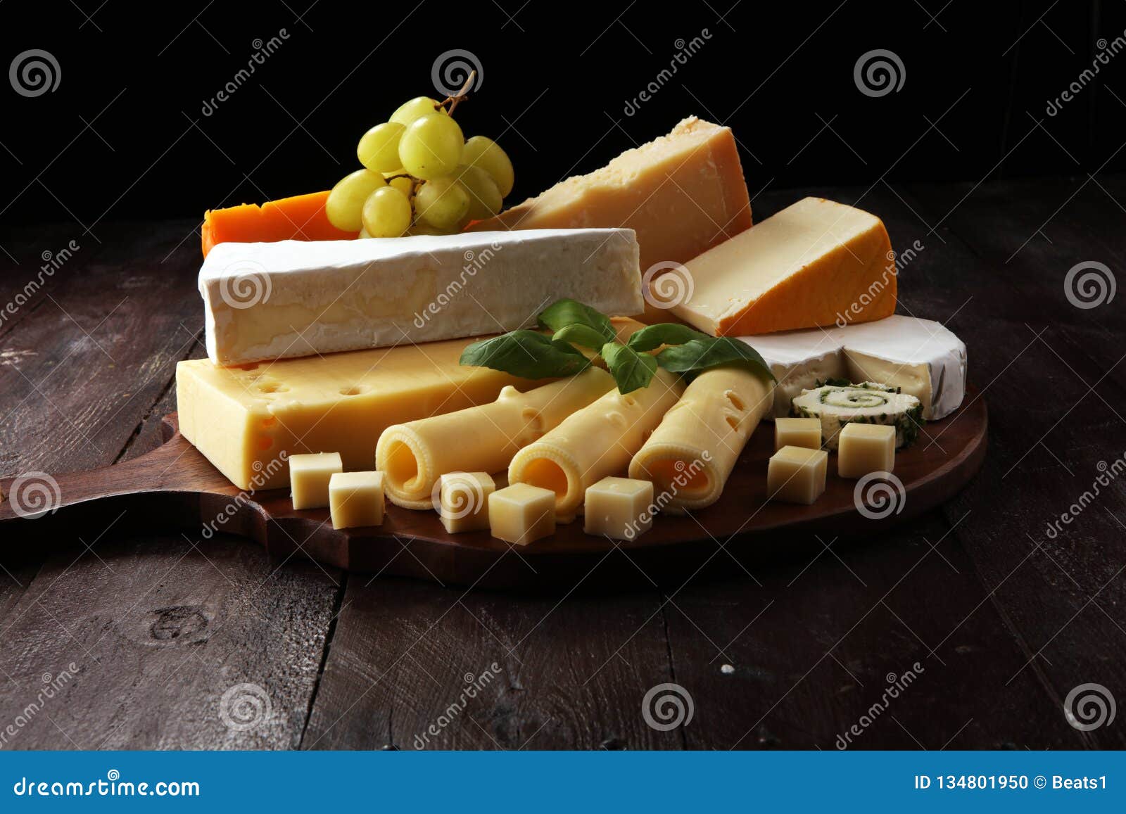 Cheese Plate Served with Grapes, Various Cheese on a Platter Stock ...
