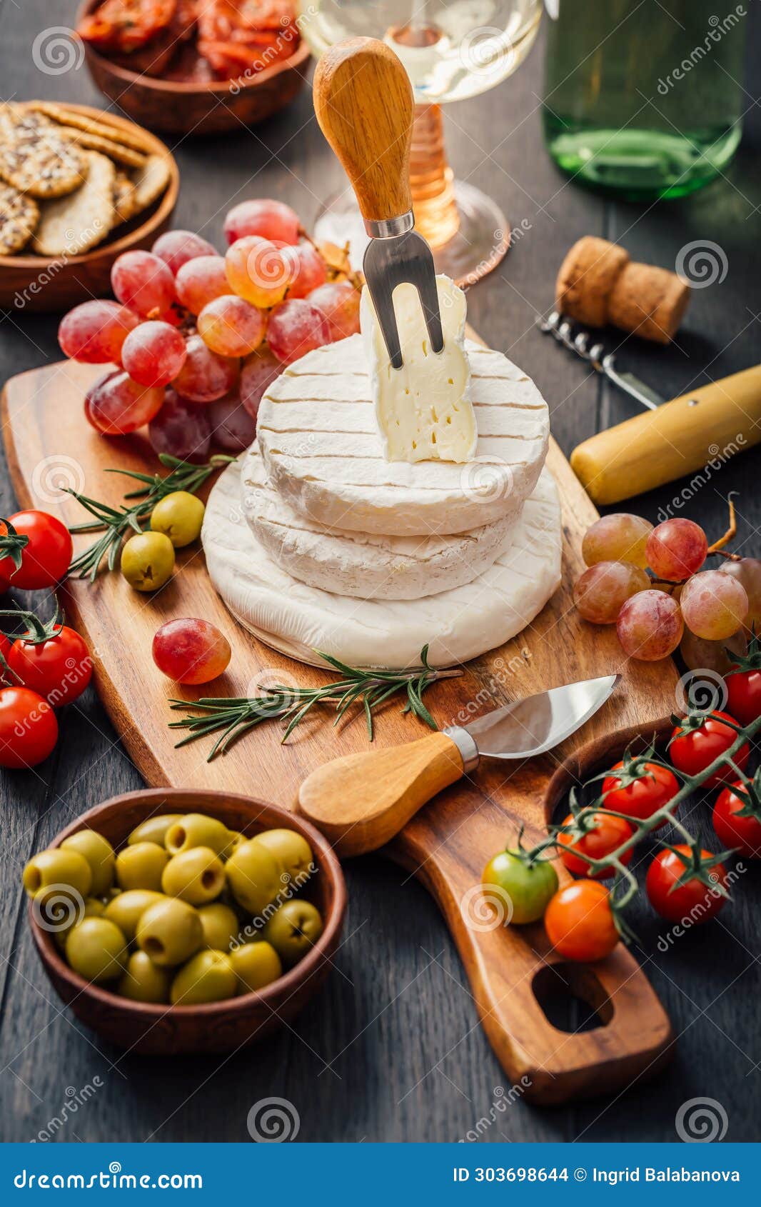 Cheese Platter with Brie, Camembert, Grapes, Olives and Tomatoes Stock ...