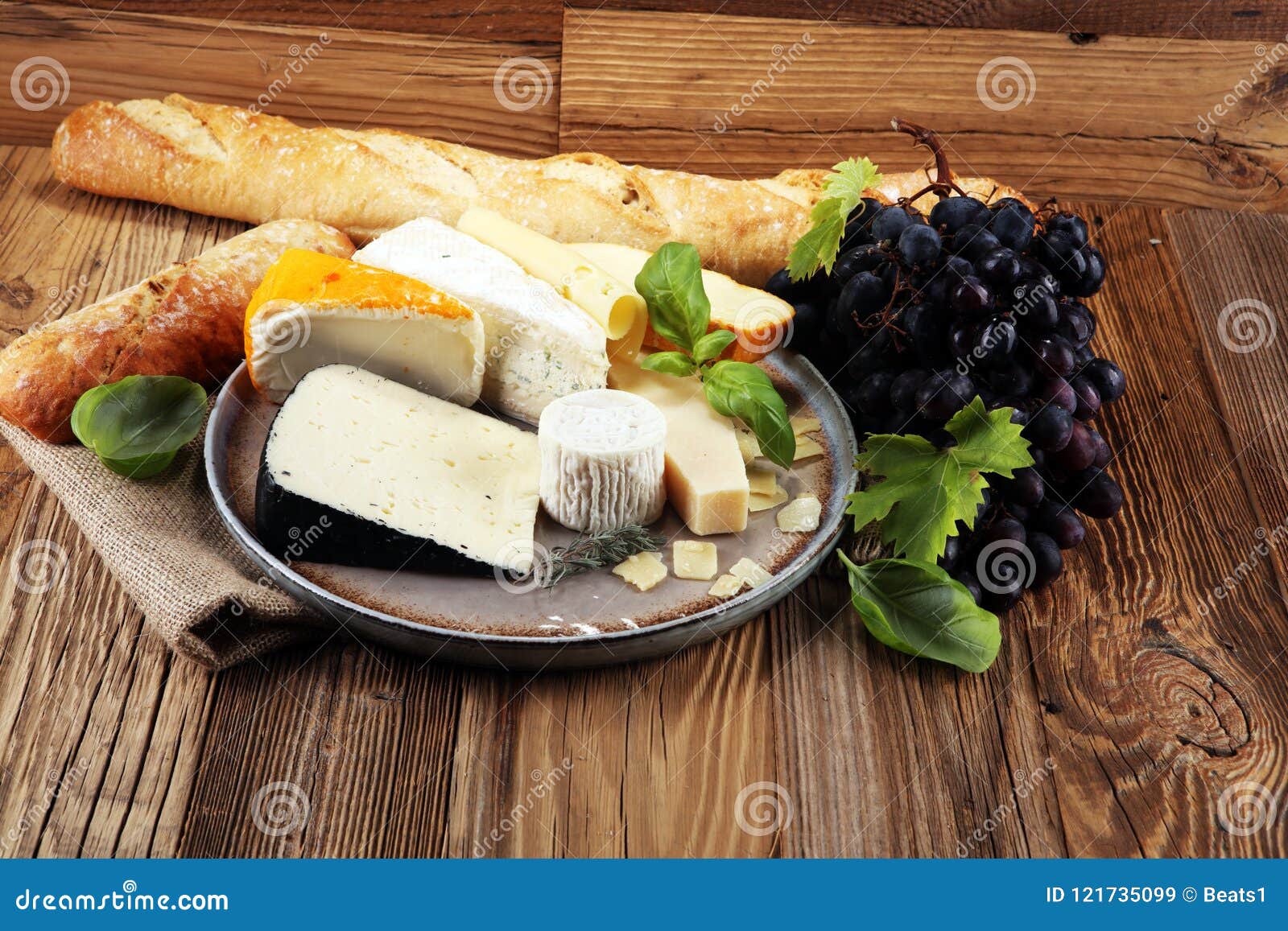 Cheese Platter with Different Cheese on Rustic Plate Stock Image ...