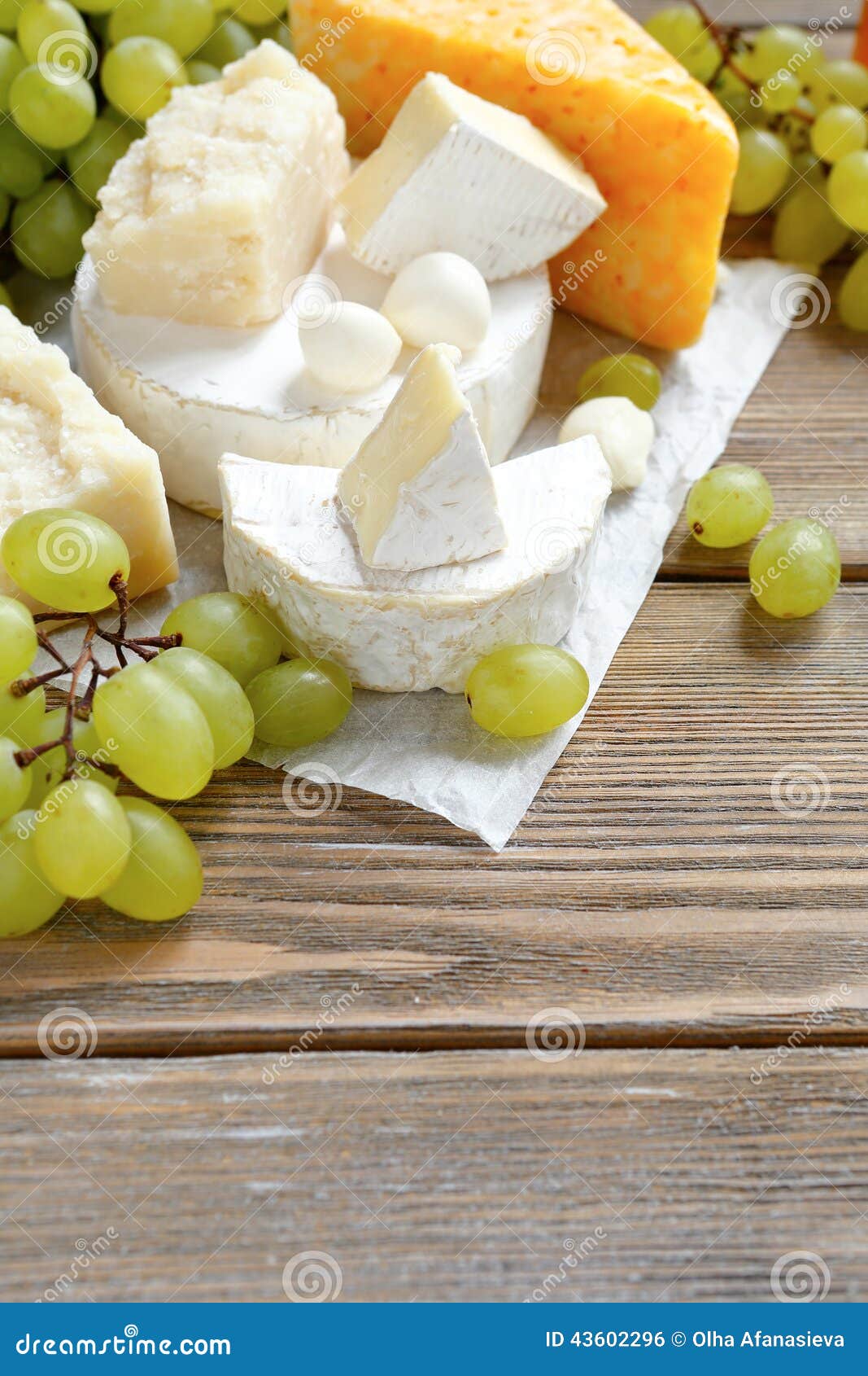 Cheese platter with grapes stock photo. Image of delicatessen - 43602296