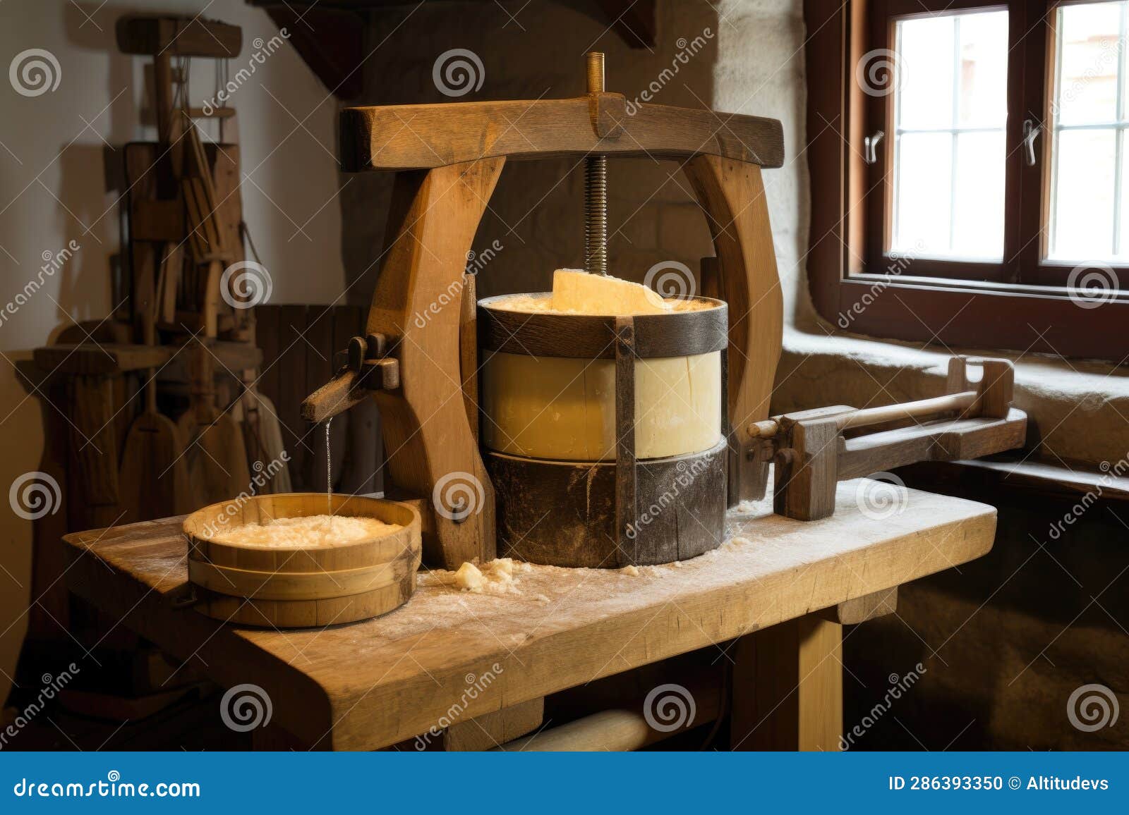Cheese Press Applying Pressure To Form a Cheese Wheel Stock Photo ...
