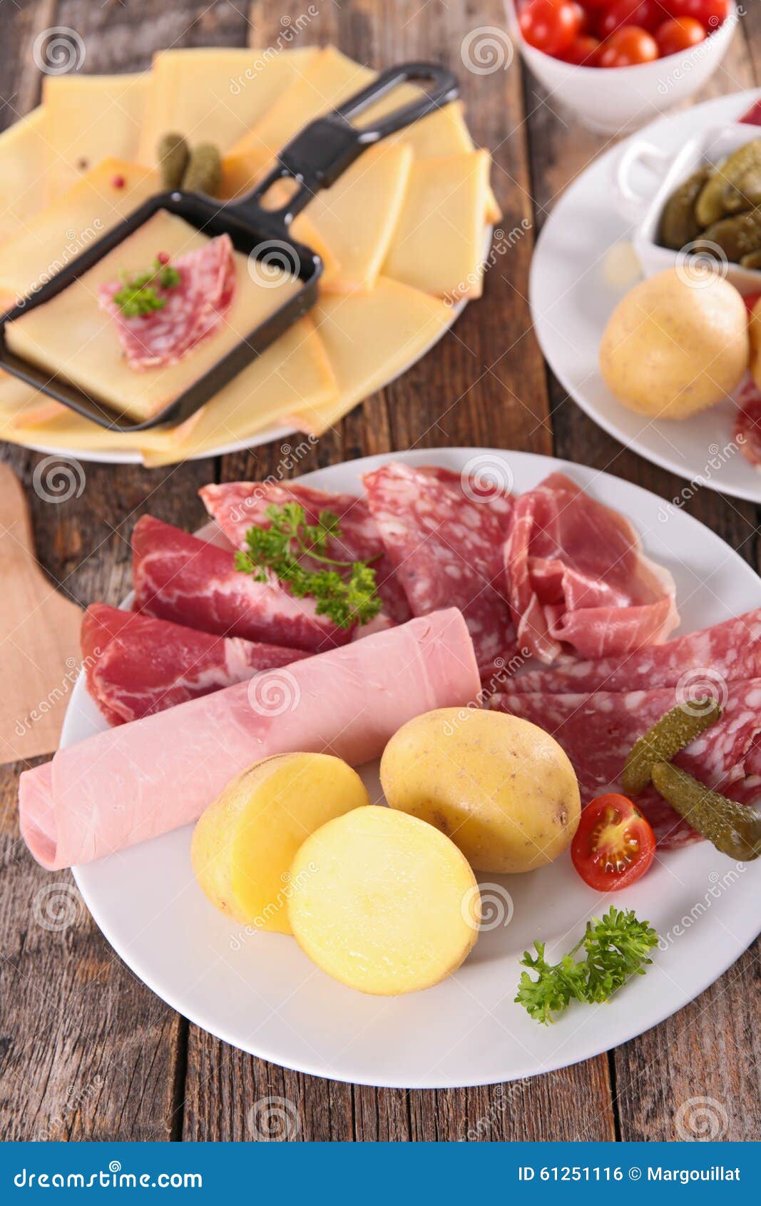 Cheese raclette dinner stock photo. Image of food, salami - 61251116