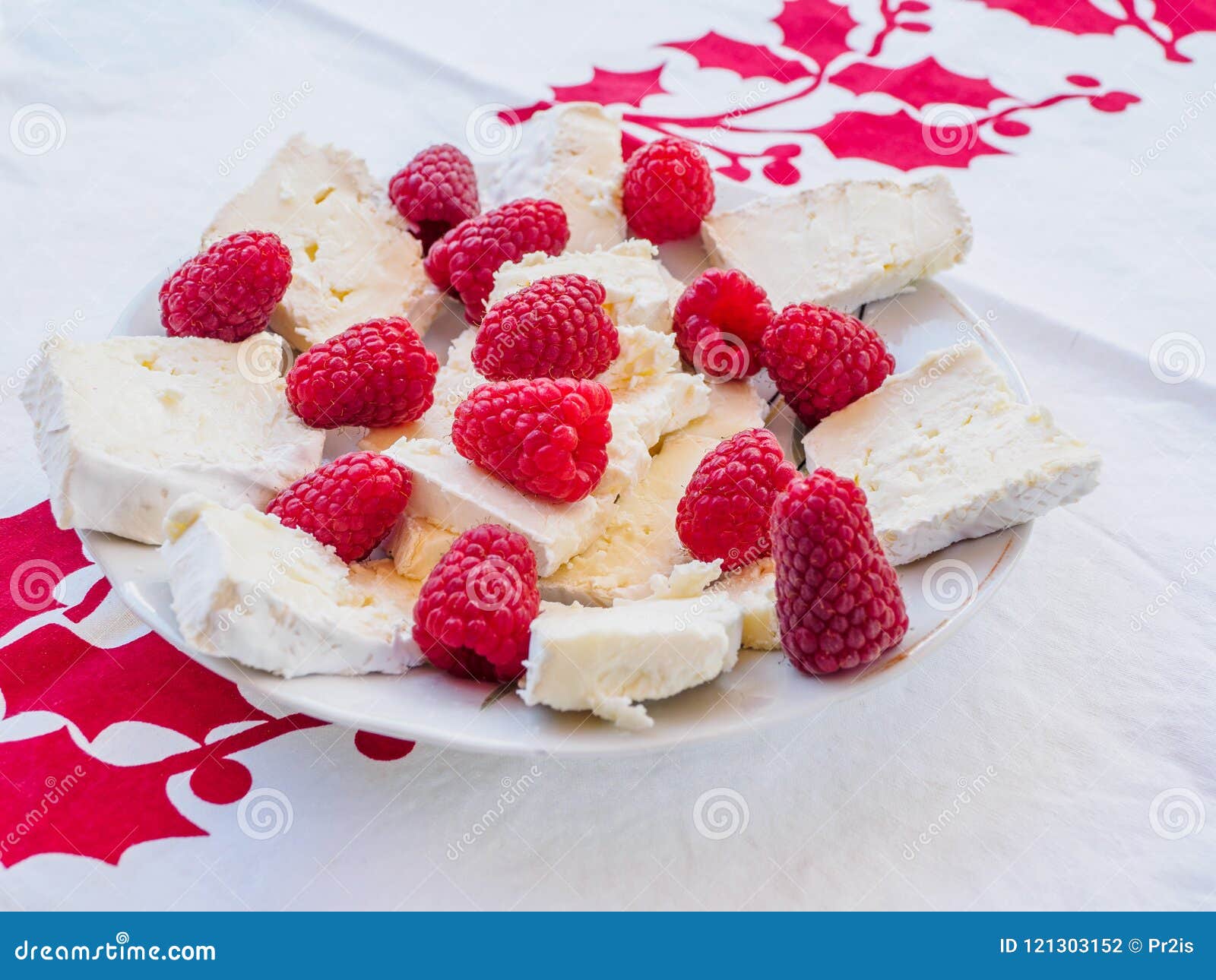Cheese and raspberries stock photo. Image of appetizer - 121303152