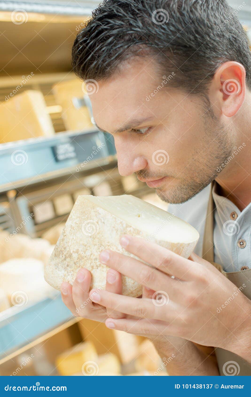 Cheese Shop Worker Smelling on Cheeses Stock Image - Image of scent ...