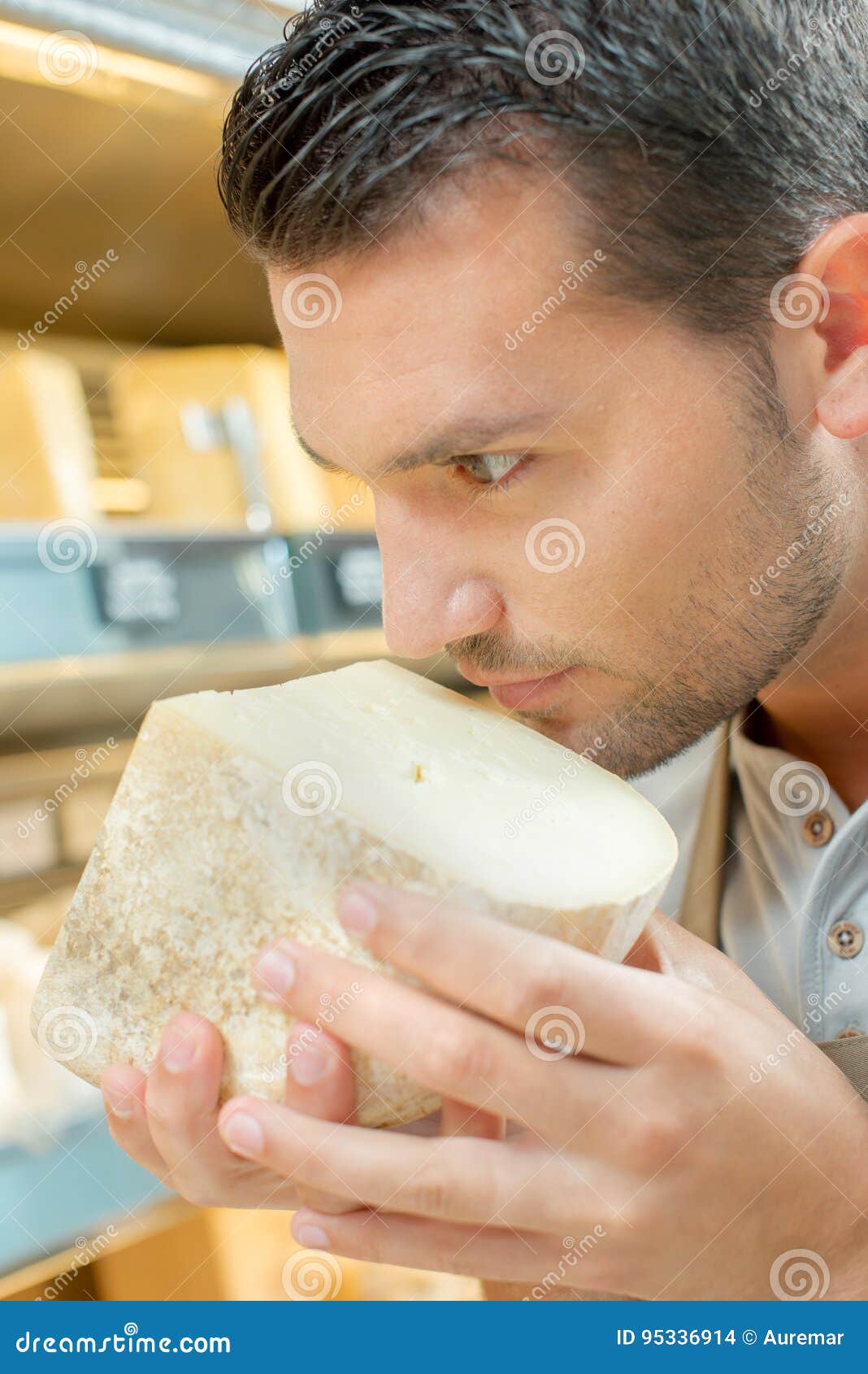 Cheese Shop Worker Smelling on Cheeses Stock Photo - Image of smell ...