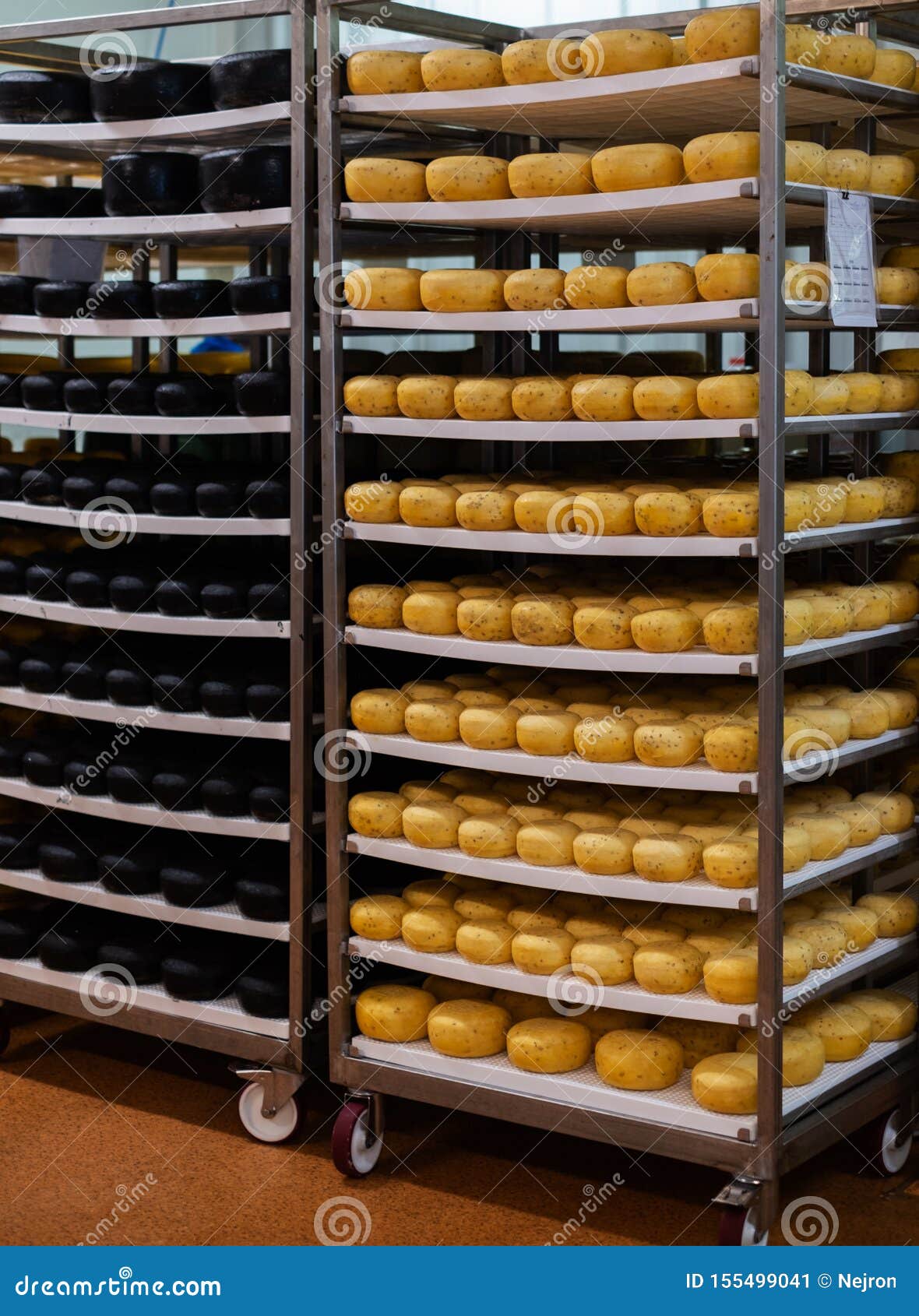 Cheese in a storage room stock image. Image of cheesemaking - 155499041