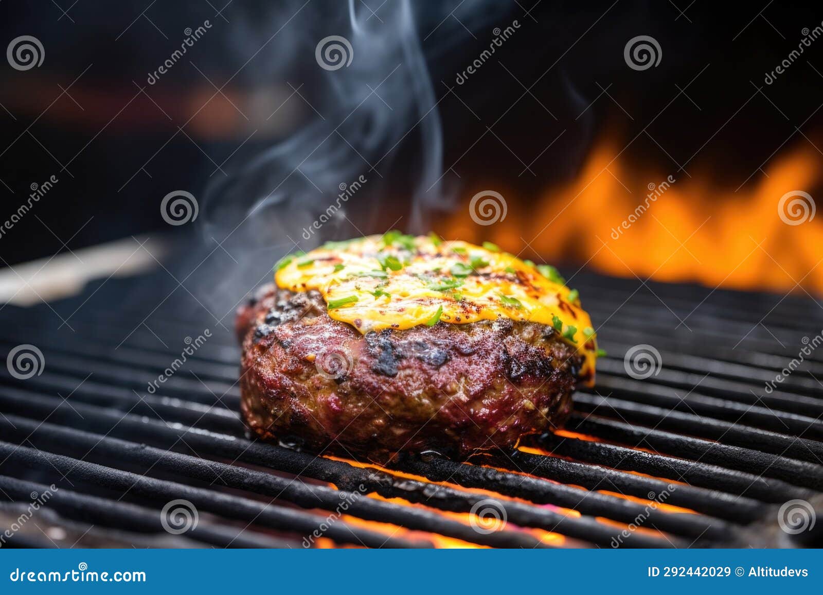 Cheese-stuffed Burger Patty Being Flipped on a Backyard Grill Stock ...