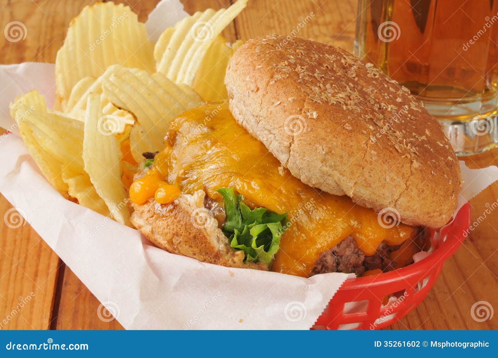 Cheeseburger with Chips and Beer Stock Photo - Image of dinner, snack ...